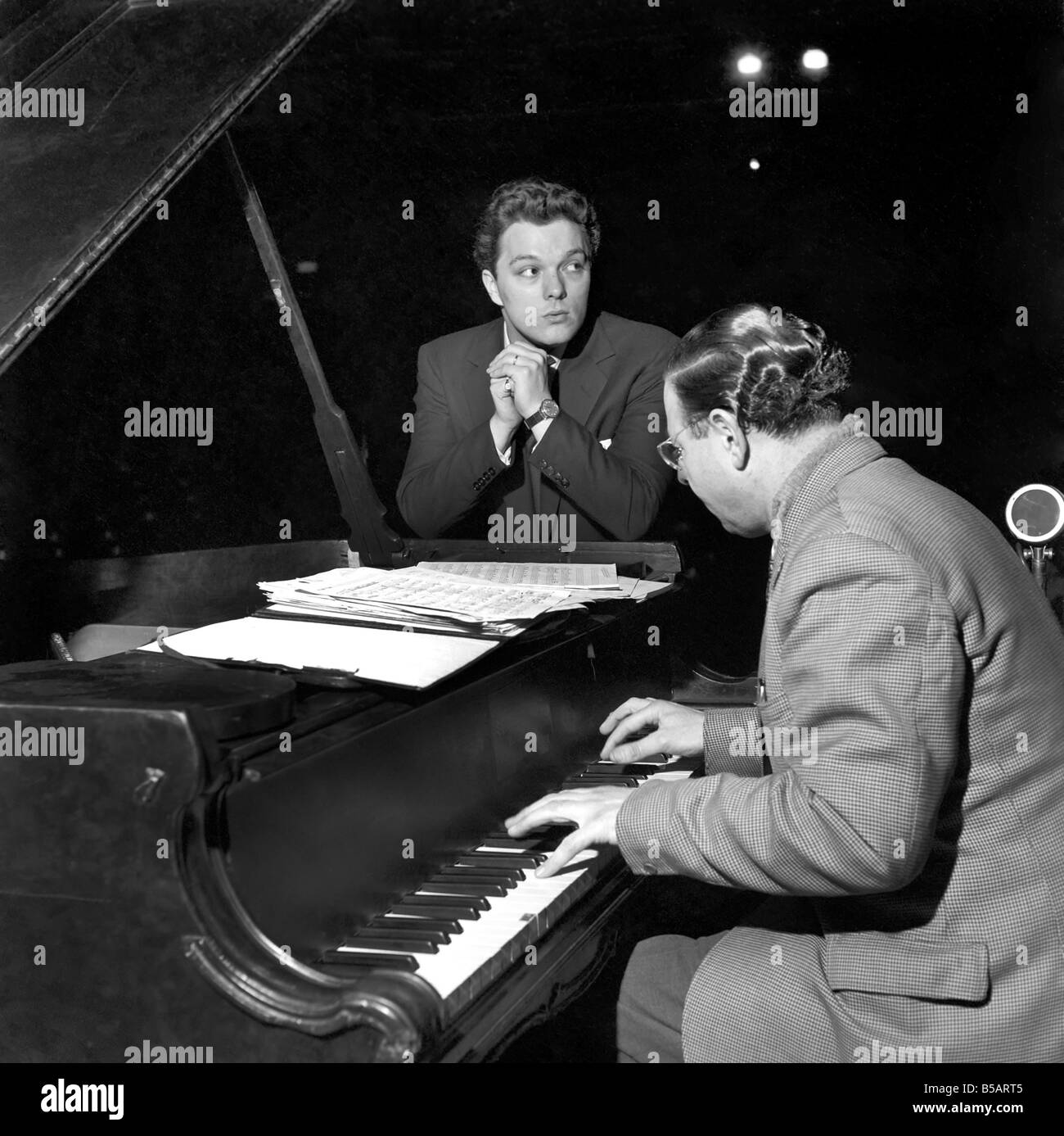 Singer Dickie Valentine seen here performing on stage. 1954 A134a-002 ...