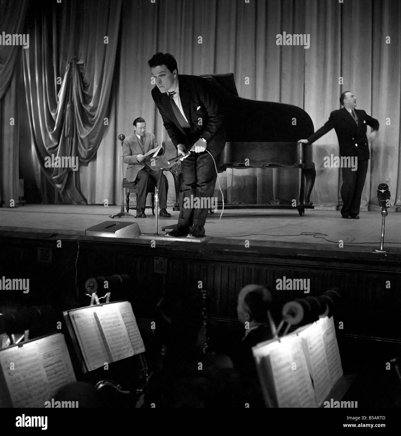 Singer Dickie Valentine seen here performing on stage. 1954 A134a-005 ...