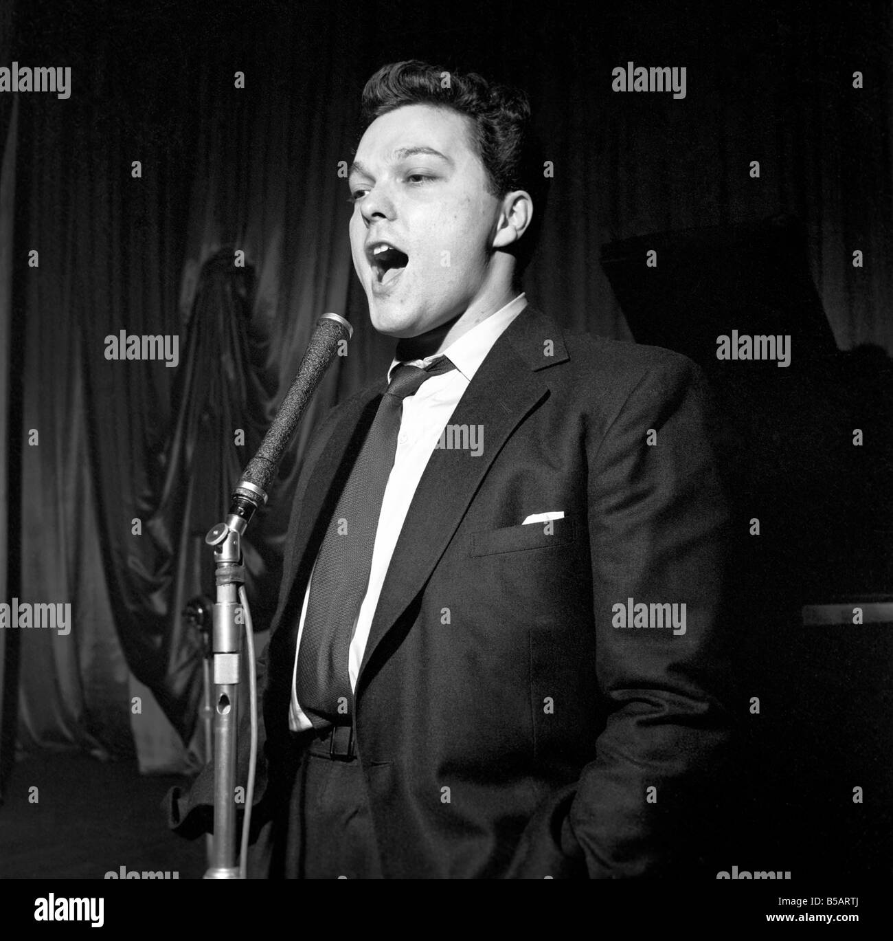 Singer Dickie Valentine seen here performing on stage. 1954 A134a Stock ...