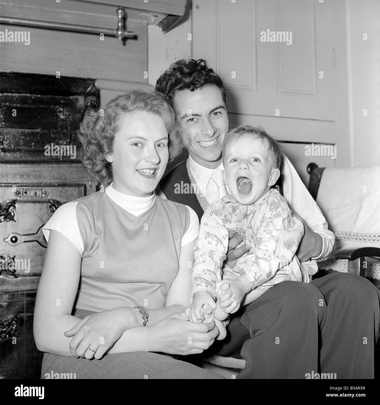 Family Life: Mr. and Mrs. Hull seen here with their son listening to ...