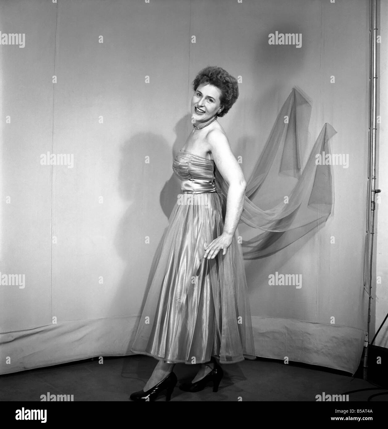 Mrs. Chapman models the latest fashions of 1953. January 1953 A28-001 ...