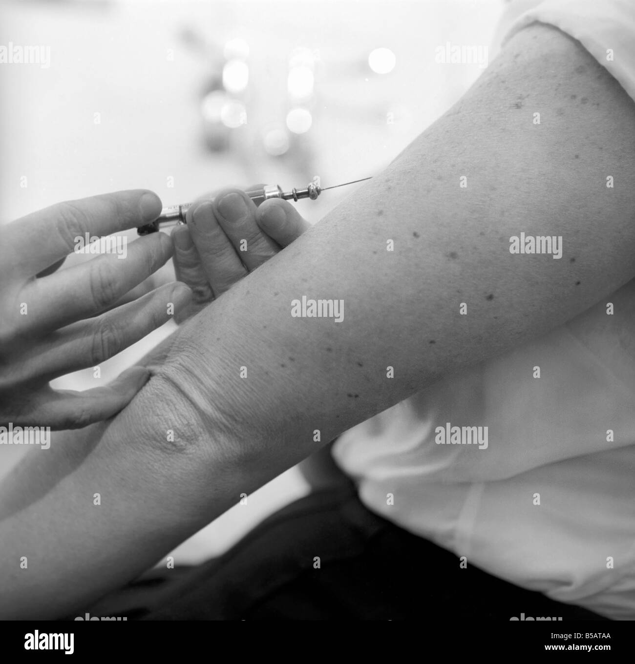 Medical: Hypodermic needle syringe used in vaccinations. March 1957 ...