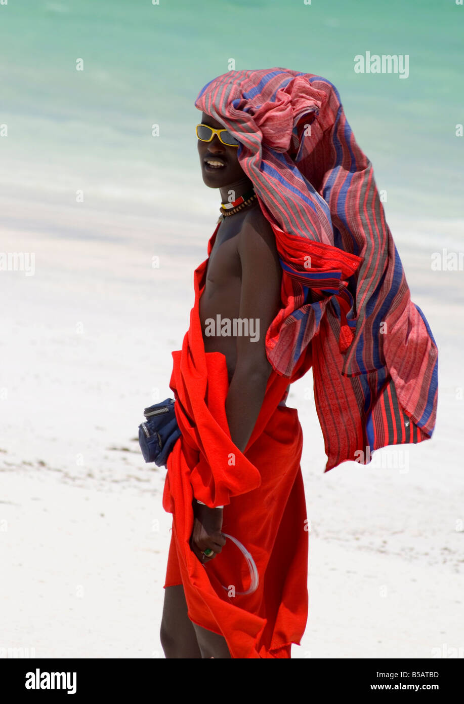 A Maasai tribesman on Paje Beach wearing colourful native dress Paje ...