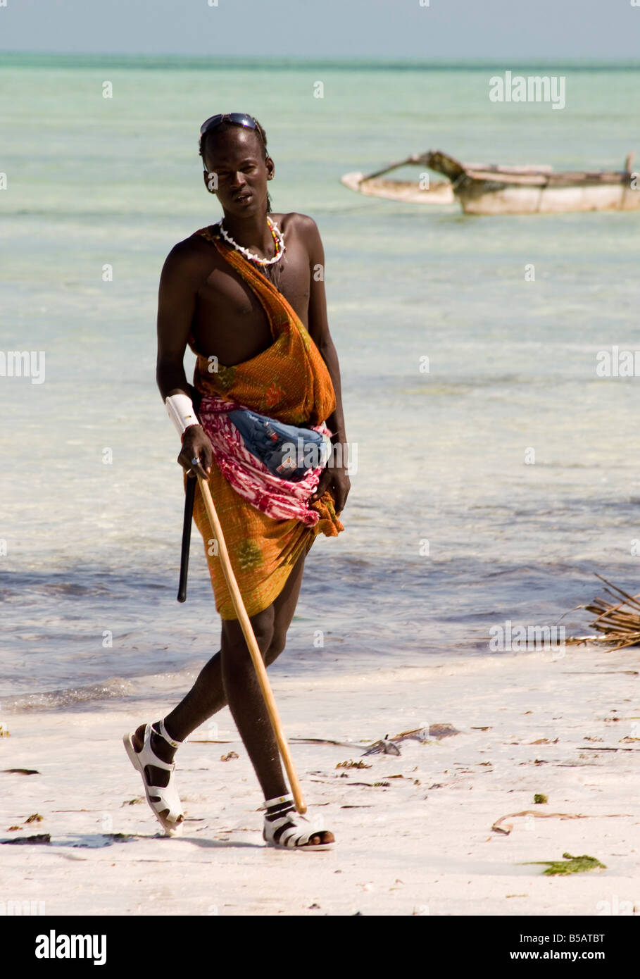 A Maasai tribesman on Paje Beach wearing colourful native dress Paje ...