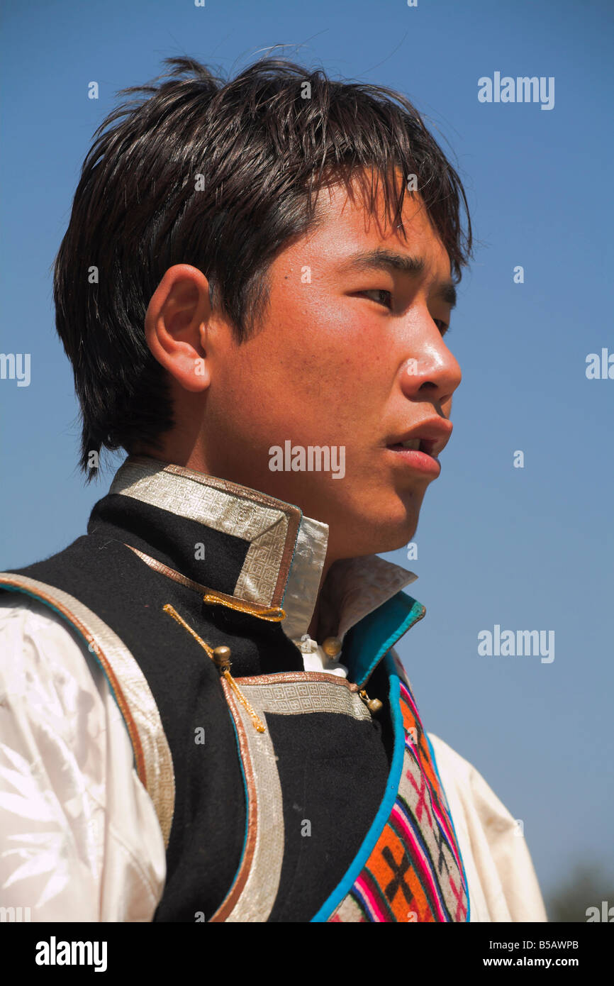 Young Tibetan man in traditional clothes during the Tibetan and Sherpa ...