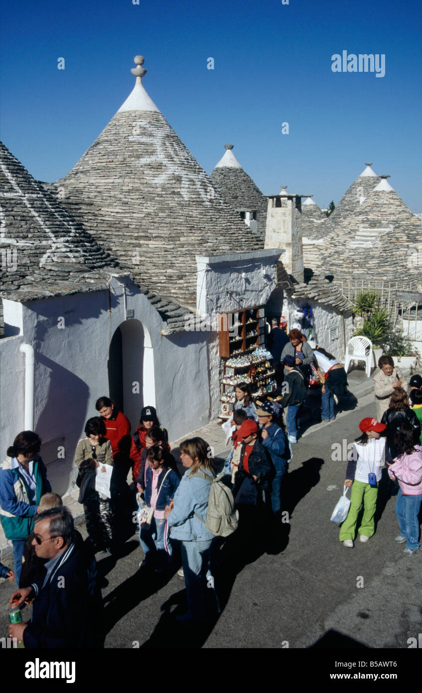 Row of trulli Houses conical shaped pointed tiled roofs White walls ...