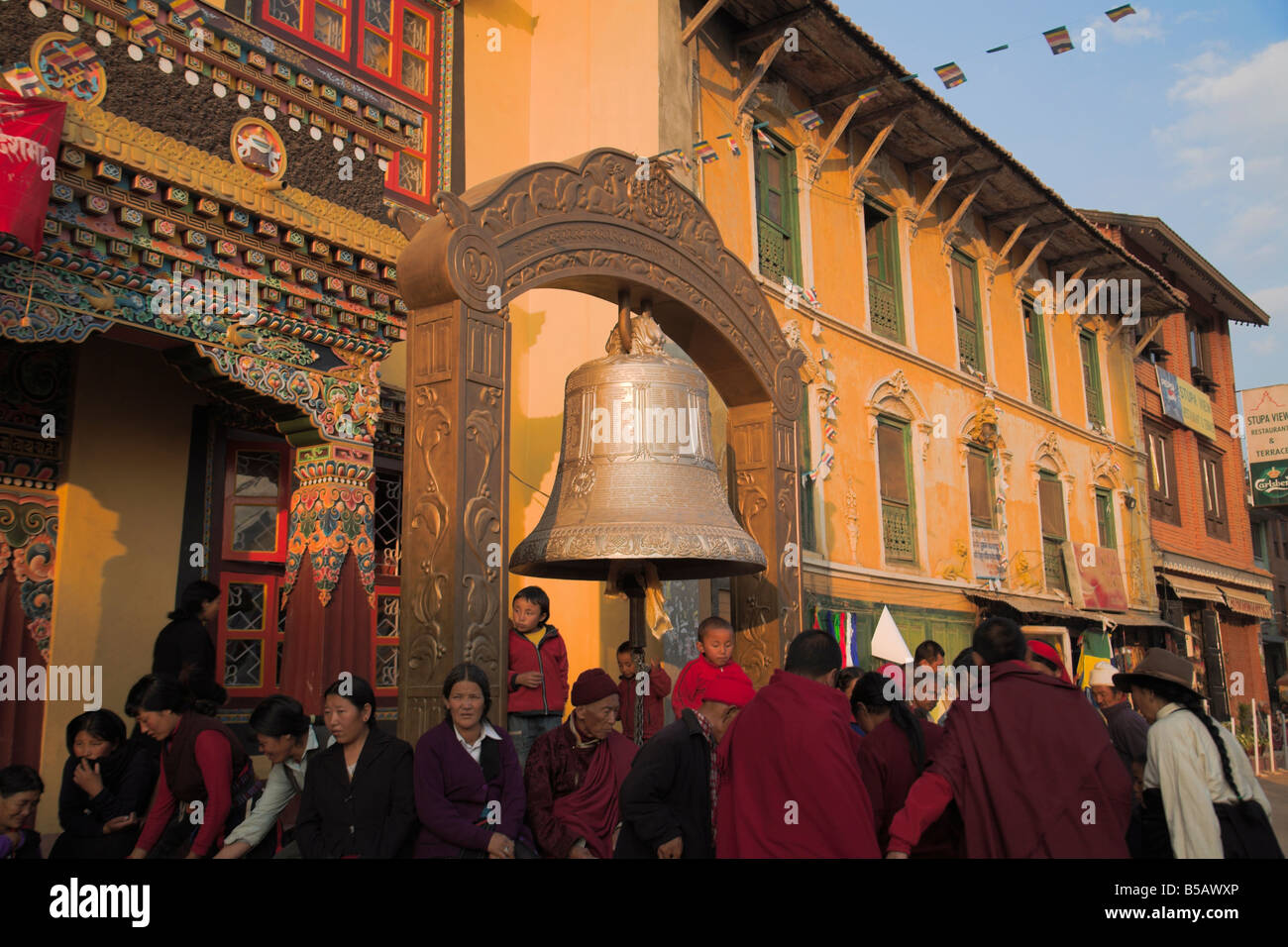 People near bell in front of monastery, Lhosar Tibetan and Sherpa New ...