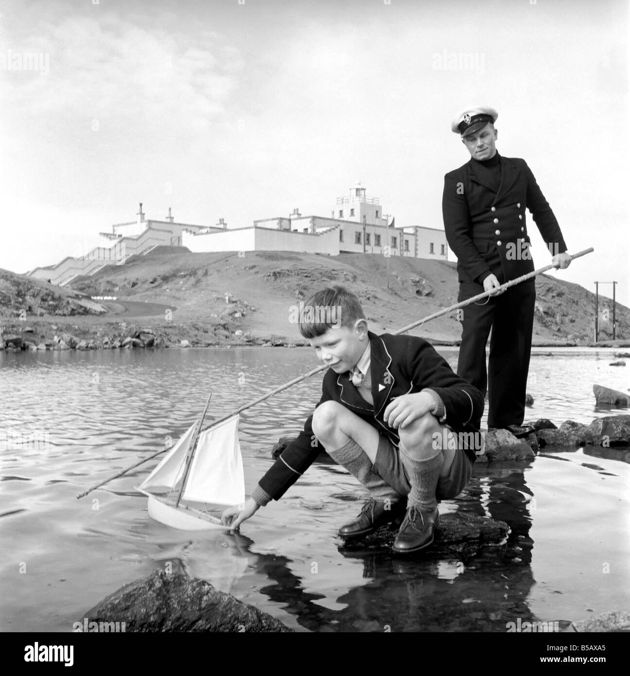 The lighthouse keepers and their families go about their daily duties ...