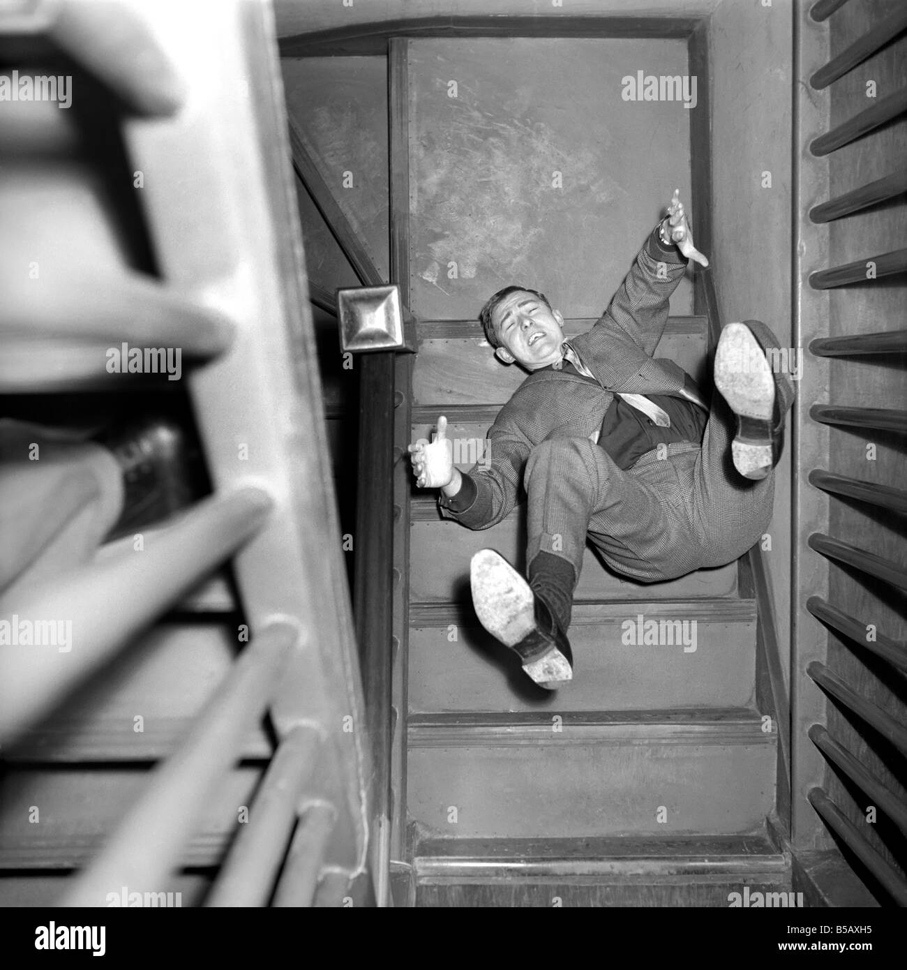 Man falling down stairs hi-res stock photography and images - Alamy
