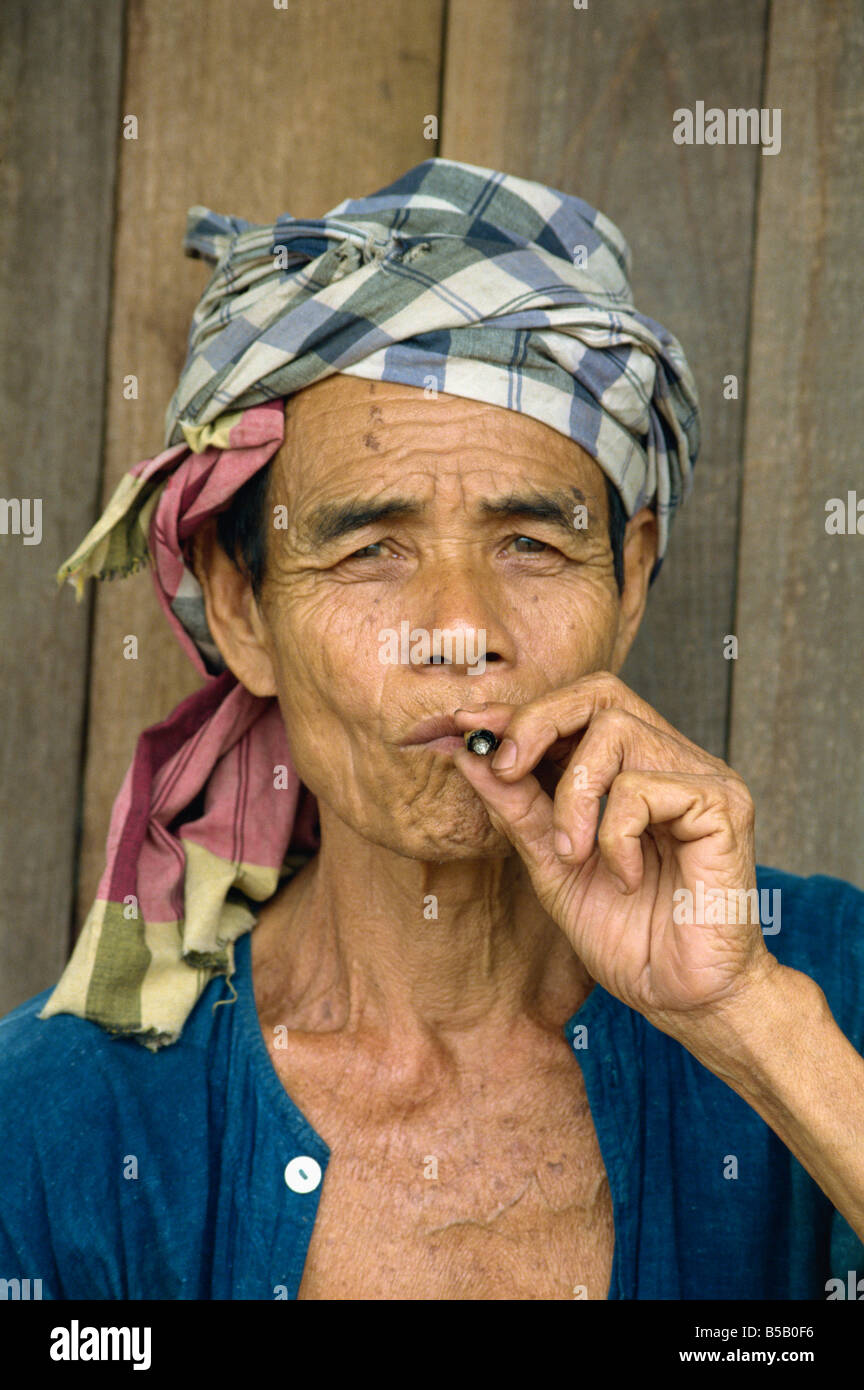 Portrait of refugee smoking Shan Man Refugee Camp Tak Maesot Thailand C ...