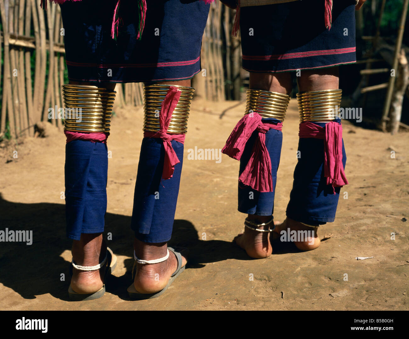 Close up of legs covered in cotton fabric and rings worn by the Paduang ...