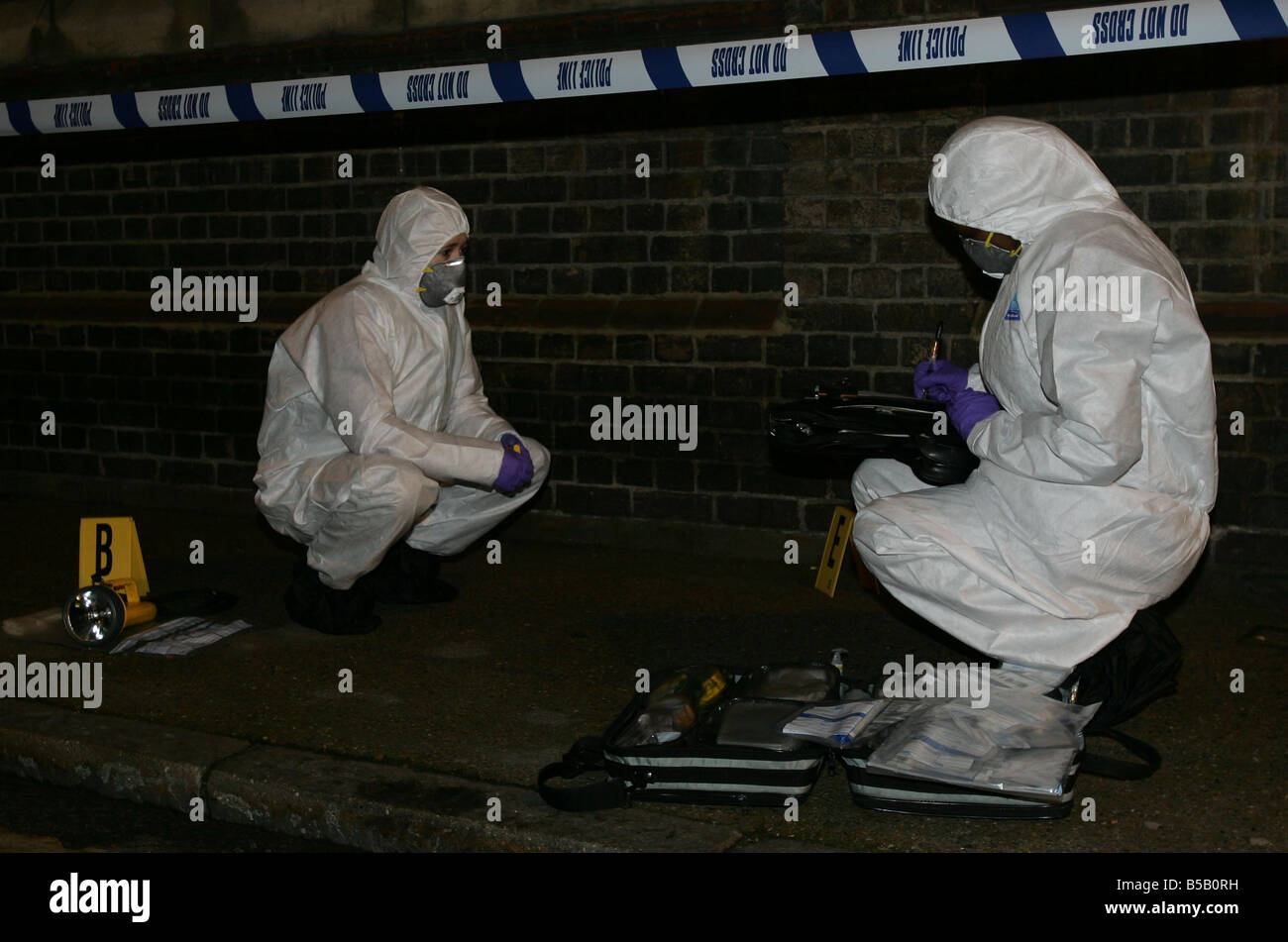 Police forensic officers investigate the scene at Porlock street in ...