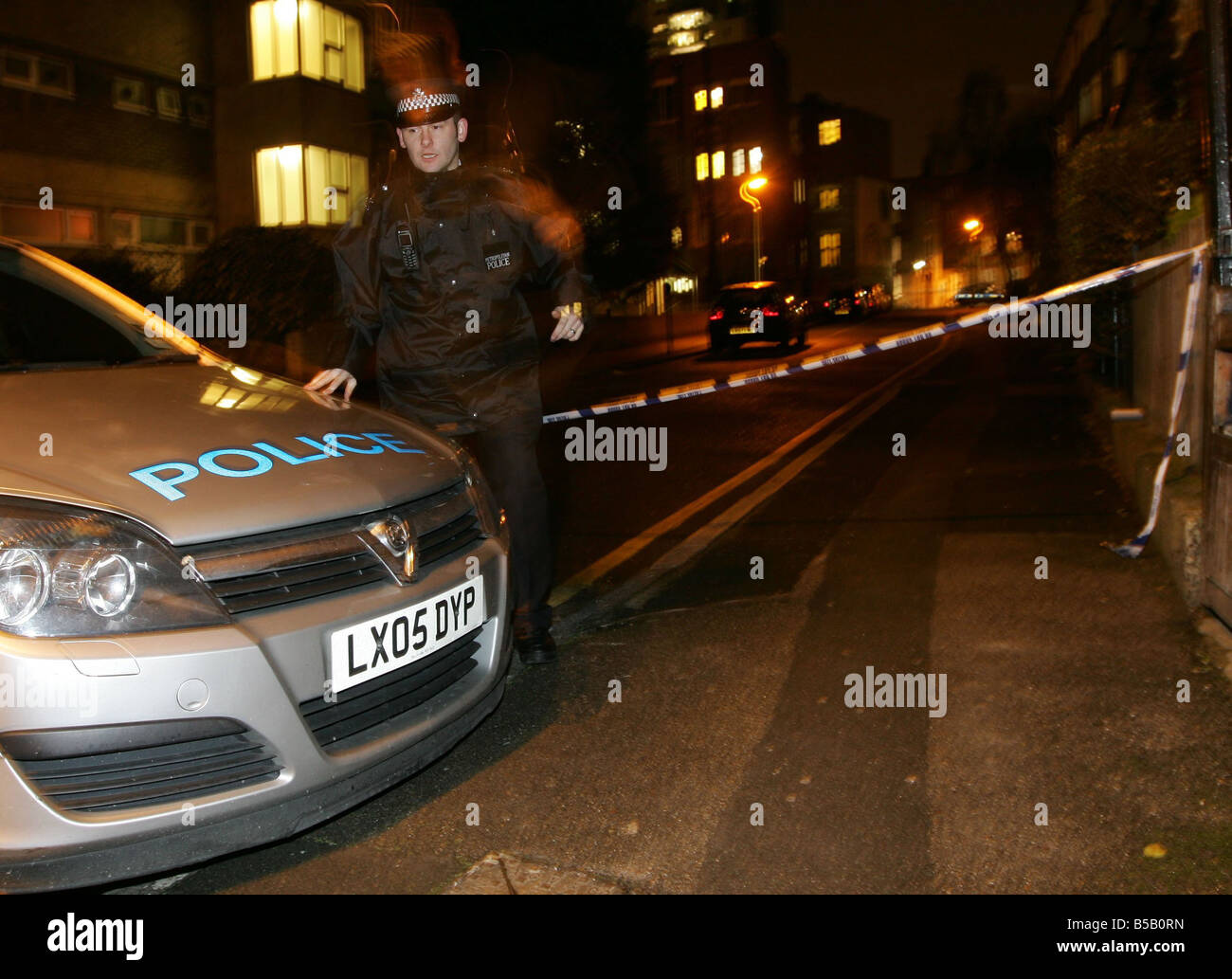 Police forensic officers investigate hi-res stock photography and ...
