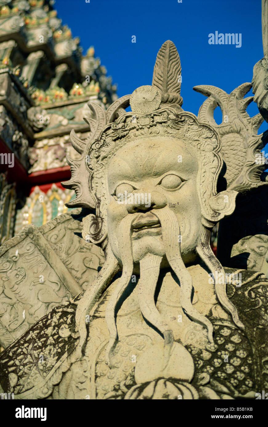 Close up of the statue of a Chinese guard at the temple of Wat Pho in ...