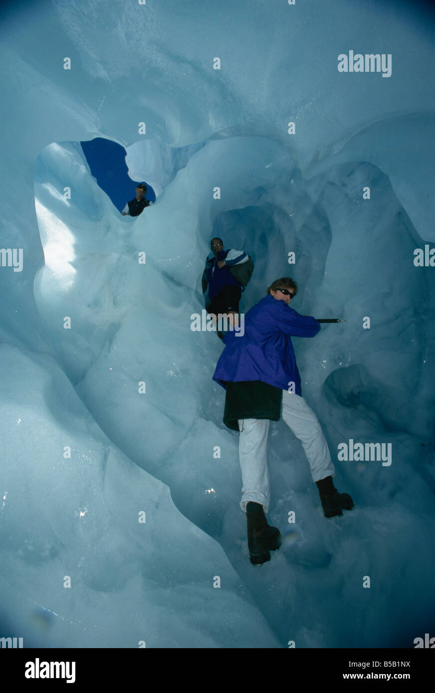 Climbing through tunnels of ice, Fox Glacier, South Island, New Zealand ...