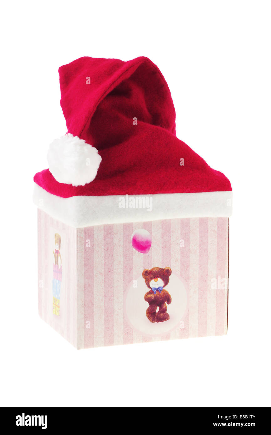 Gift box wearing a Santa hat on white background Stock Photo - Alamy