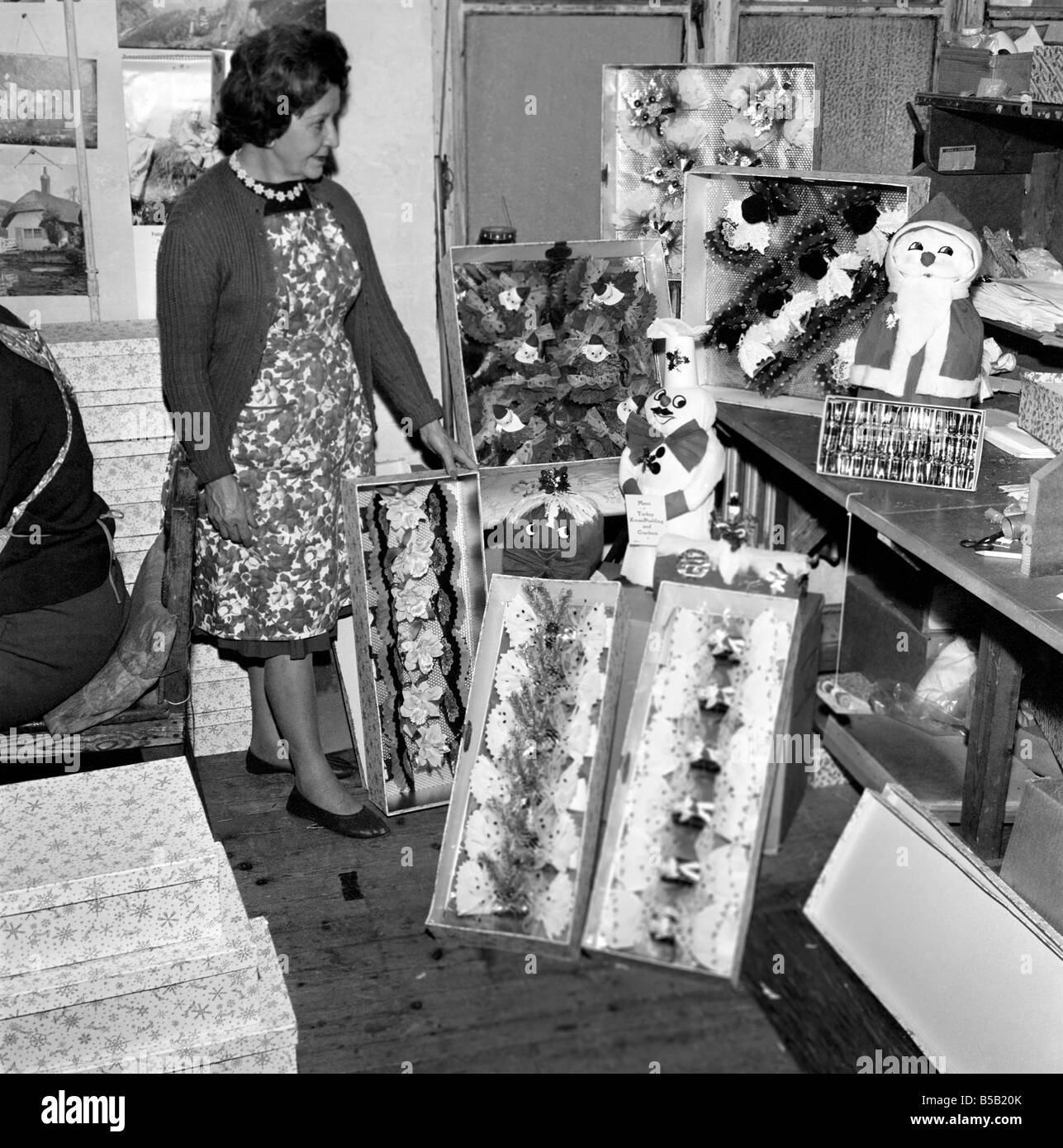 General scene in and around a Christmas cracker factory, where women ...