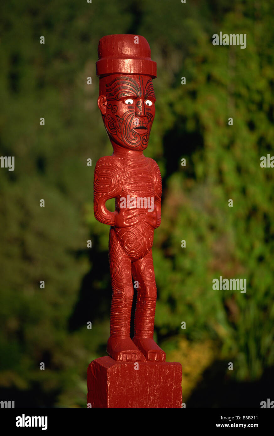 A carved figure or poupou in a Maori village at the Whakarewarewa ...