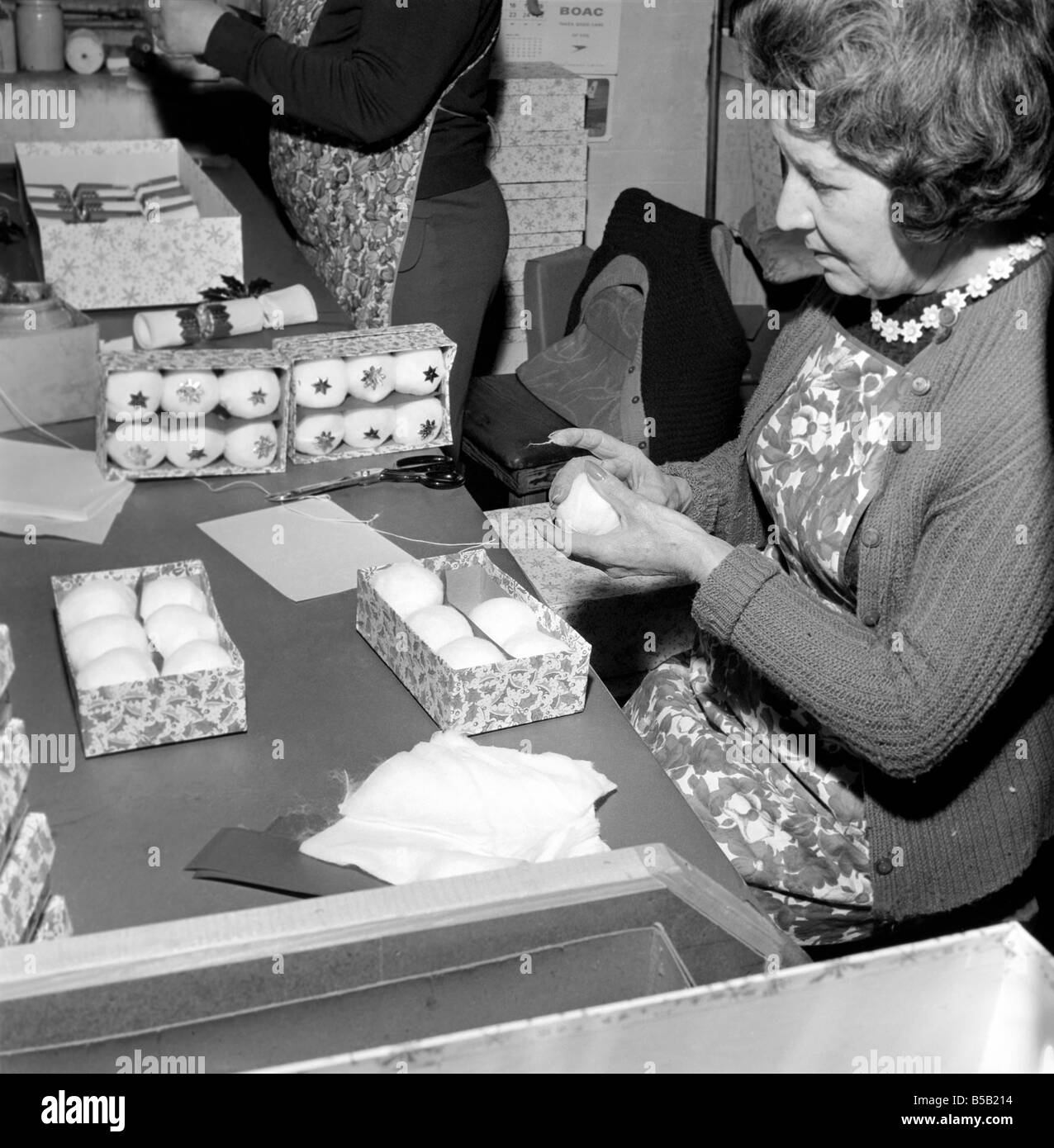 General scene in and around a Christmas cracker factory, where women ...