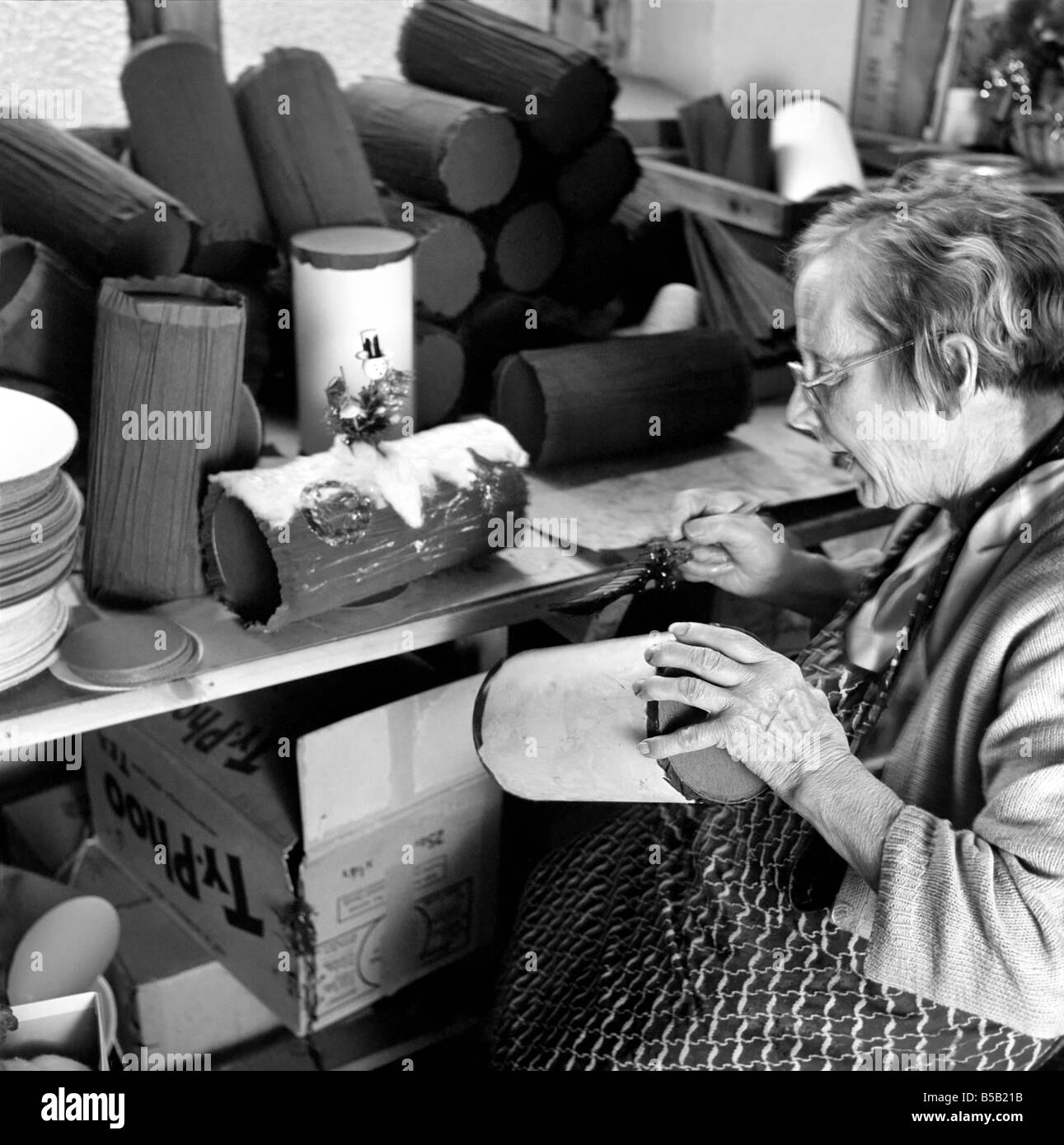 General scene in and around a Christmas cracker factory, where women ...