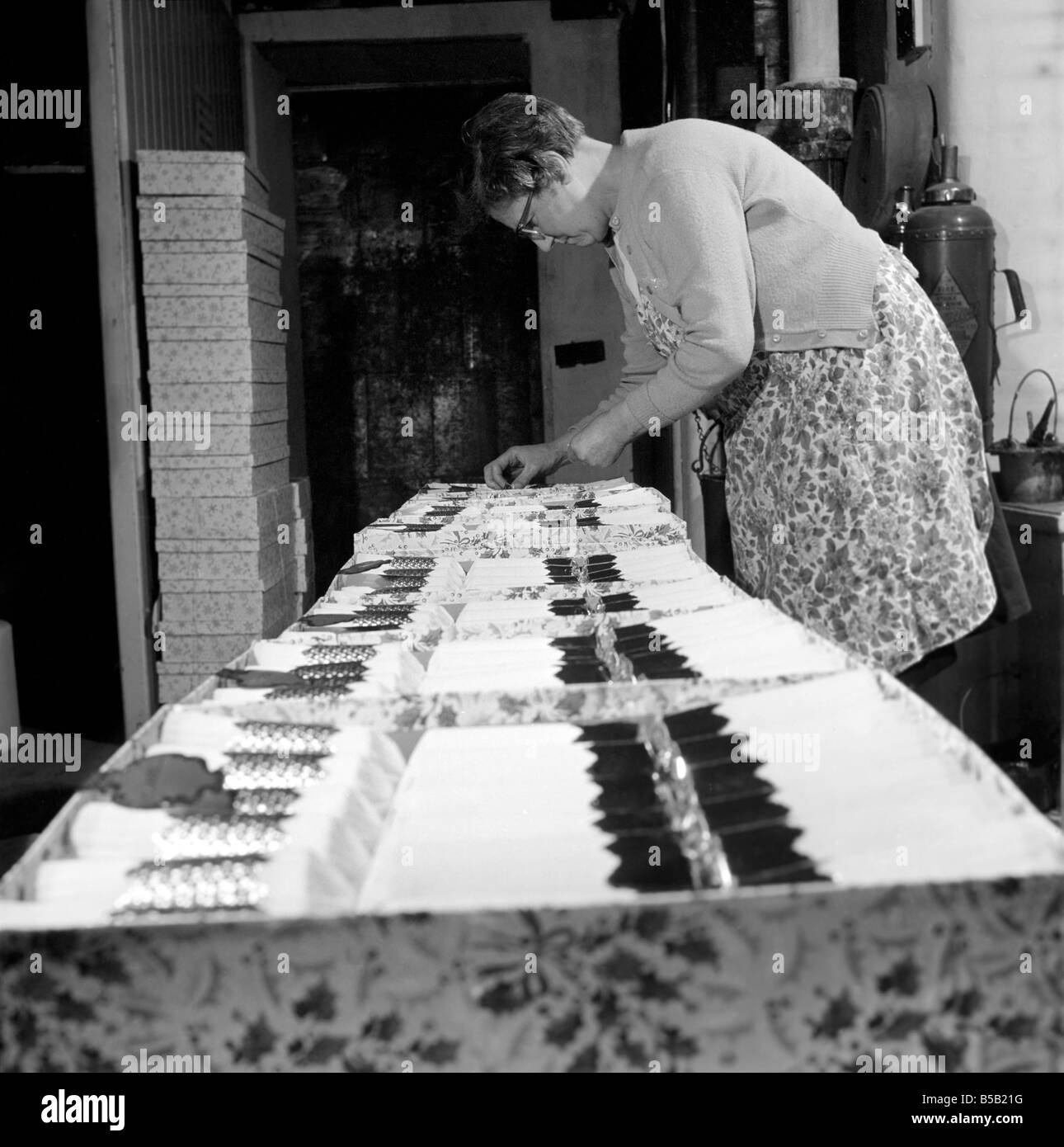 General scene in and around a Christmas cracker factory, where women ...