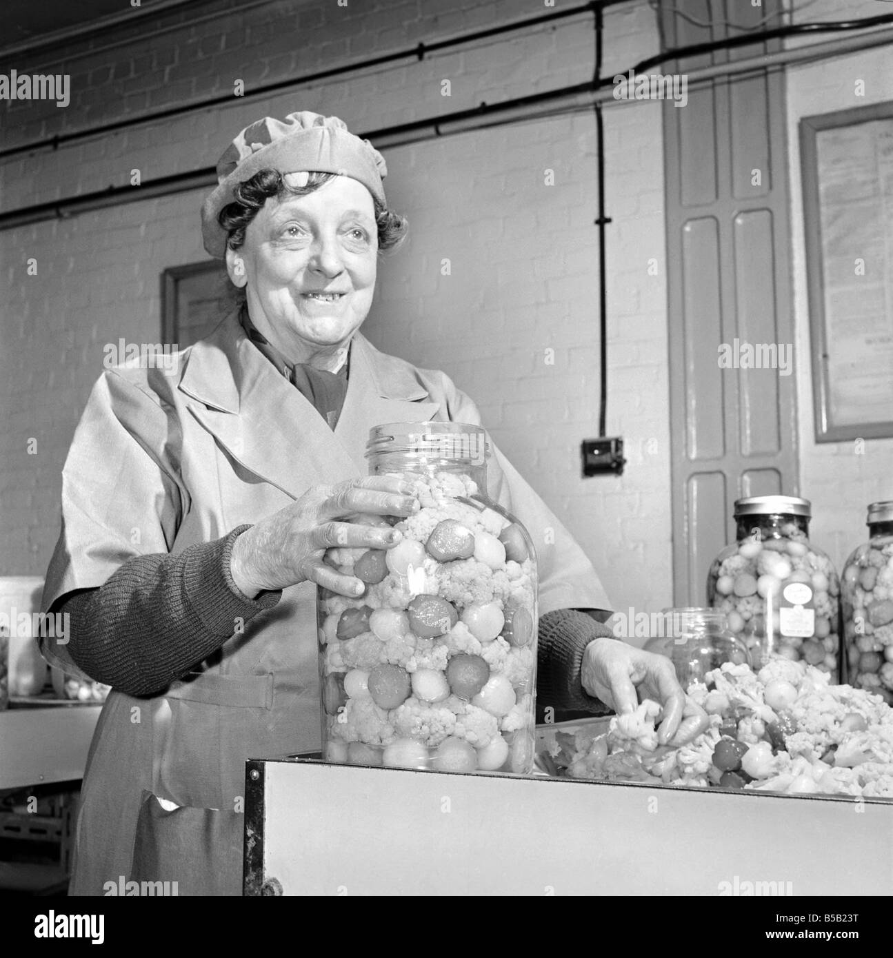 Pickle Packers: Pickle packers placing onions in jars. 1954 A156-001 ...