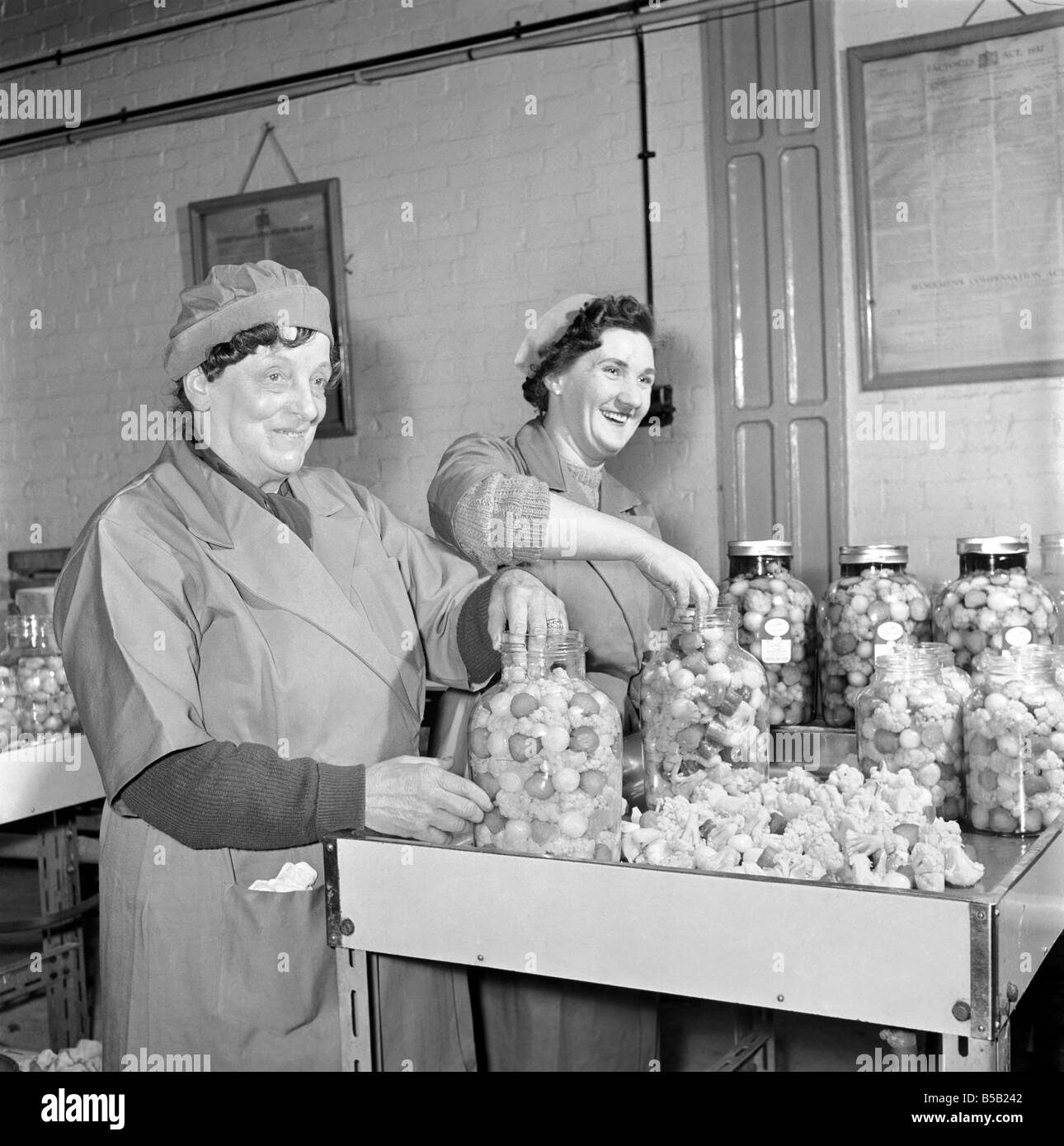 Pickle Packers: Pickle packers placing onions in jars. 1954 A156-004 ...
