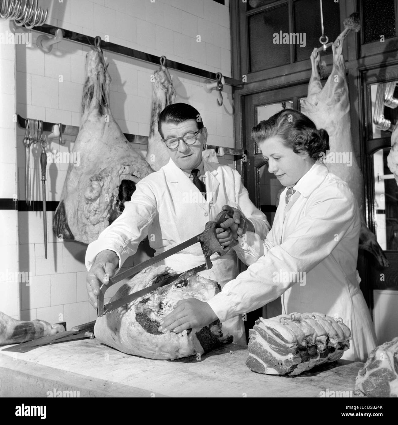 Woman butcher seen here at work. 1954 Stock Photo - Alamy