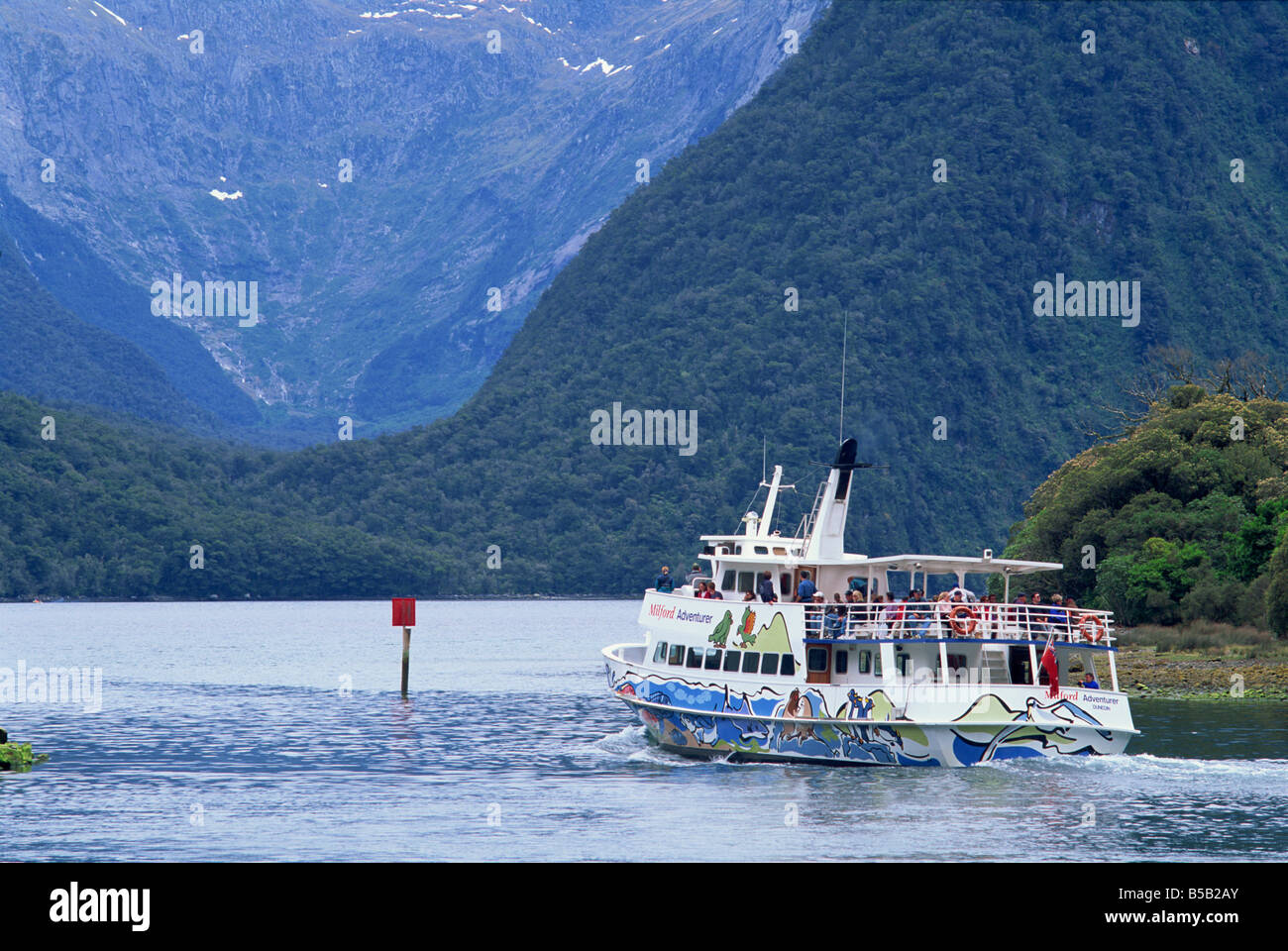 Tourists on a Fiord Boat Tour on the Milford Sound in the South Island ...