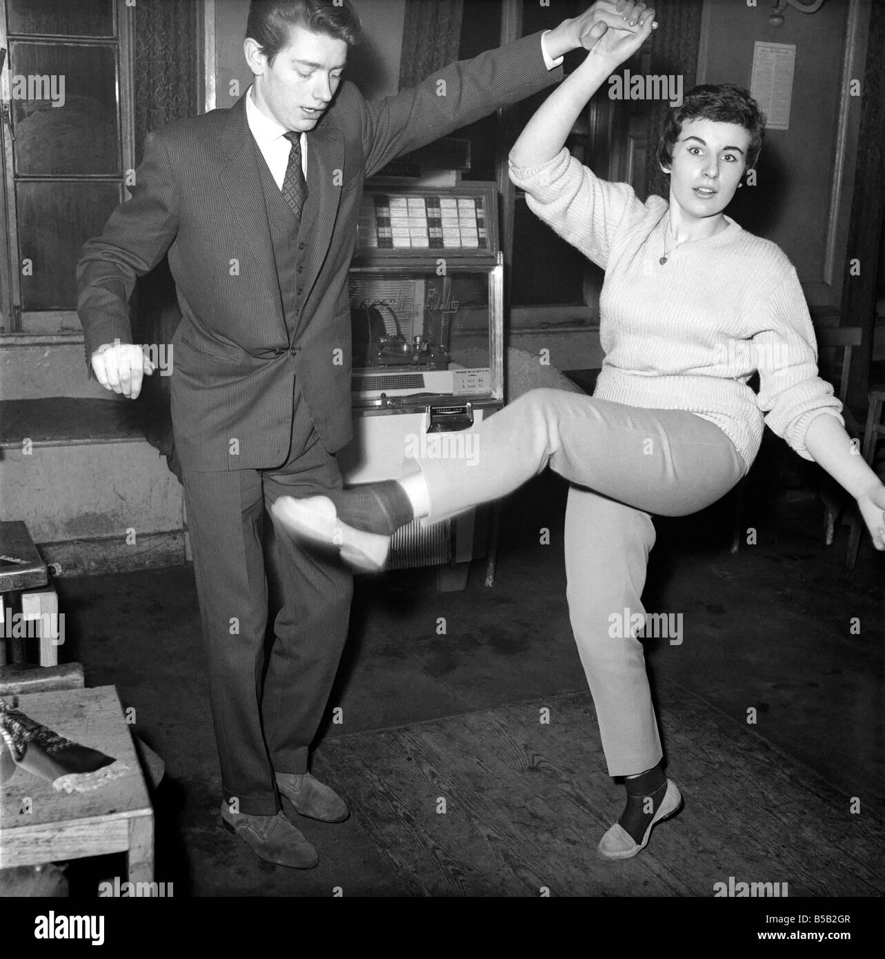 Couple dancing to music from juke box. 1960 Stock Photo - Alamy