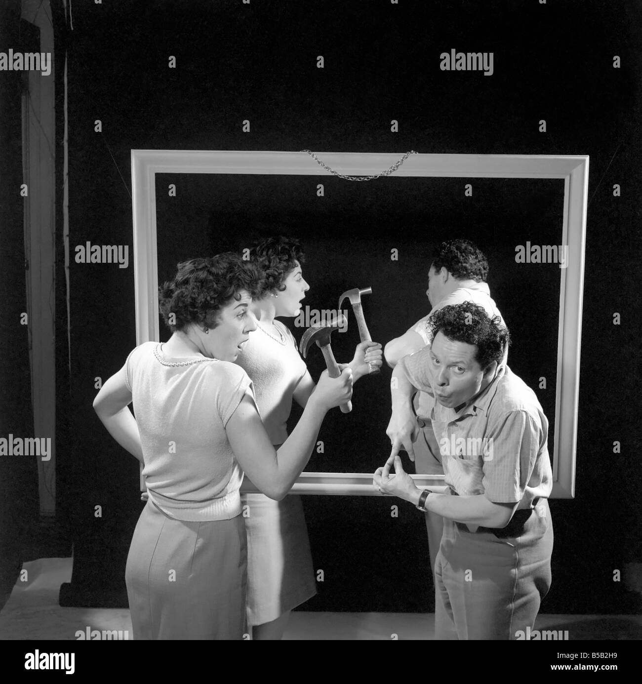 Mirror image: A couple argue in front of a mirror. 1958 Stock Photo - Alamy