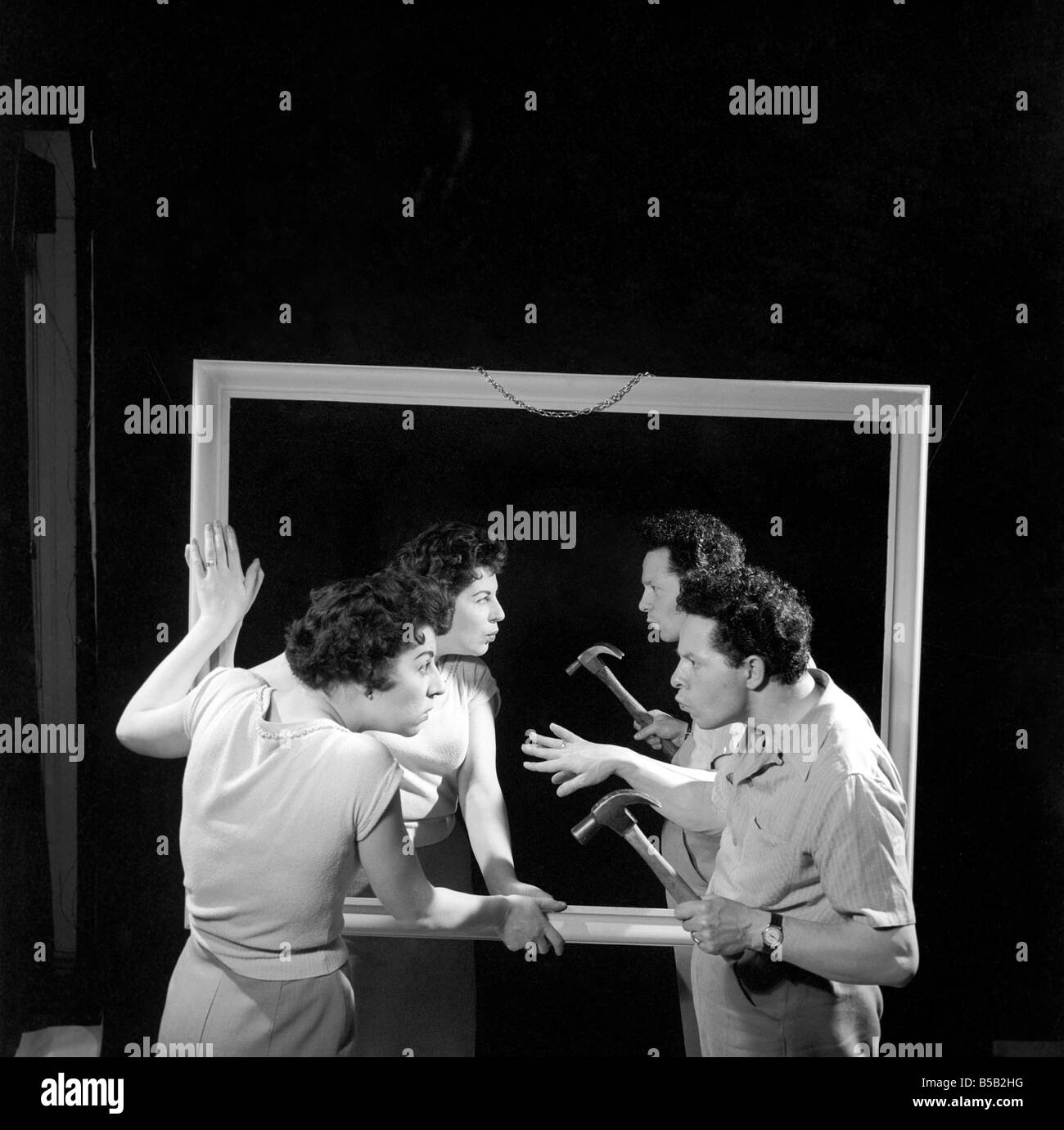 Mirror image: A couple argue in front of a mirror. 1958 Stock Photo - Alamy