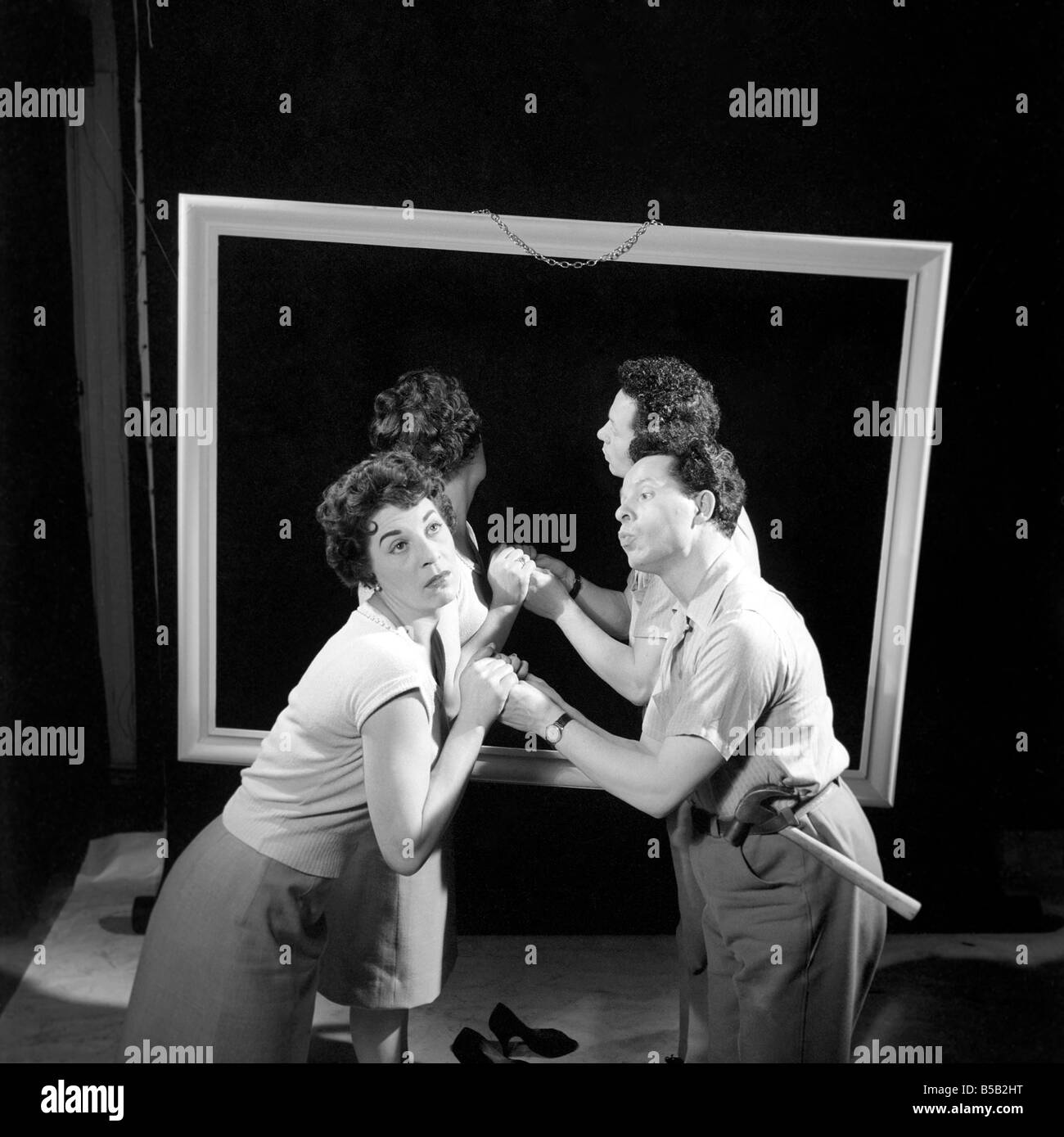 Mirror image: A couple argue in front of a mirror. 1958 Stock Photo - Alamy