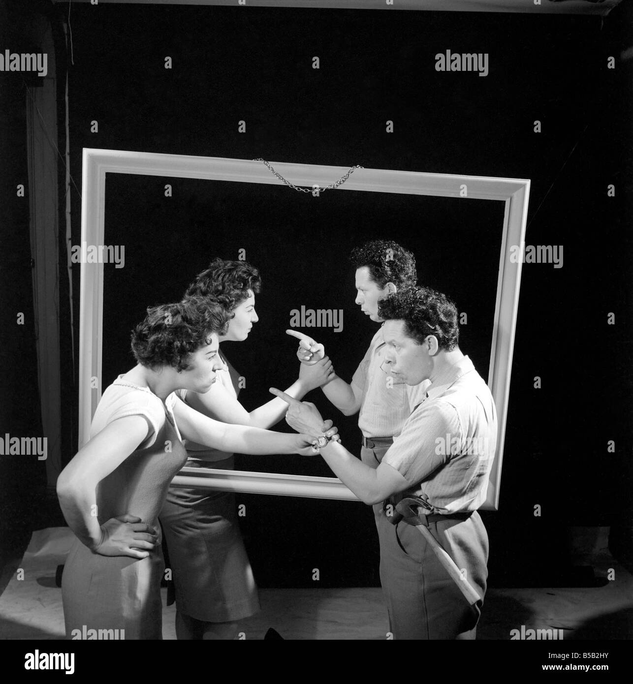 Mirror image: A couple argue in front of a mirror. 1958 Stock Photo - Alamy