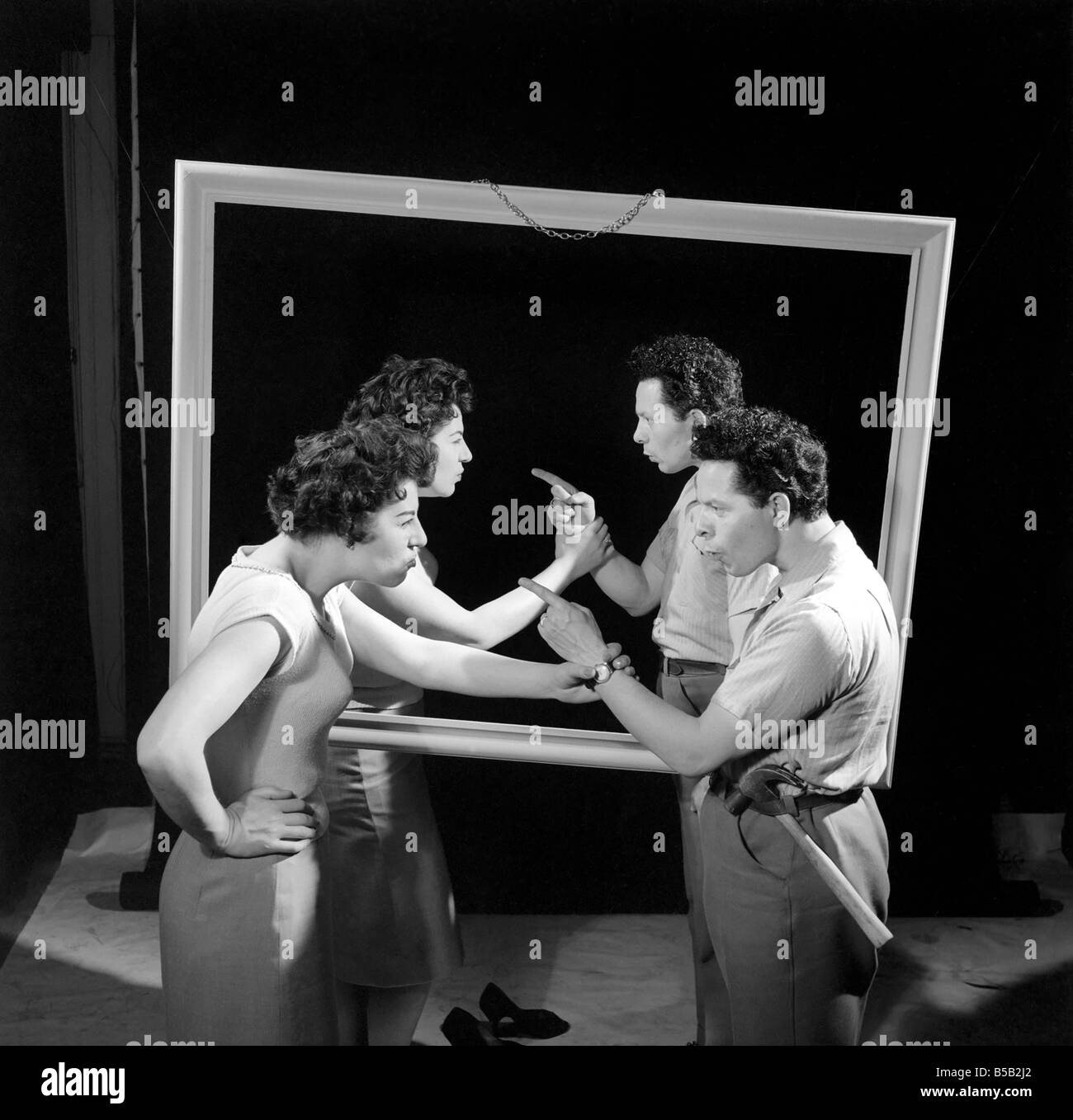 Mirror image: A couple argue in front of a mirror. 1958 Stock Photo - Alamy