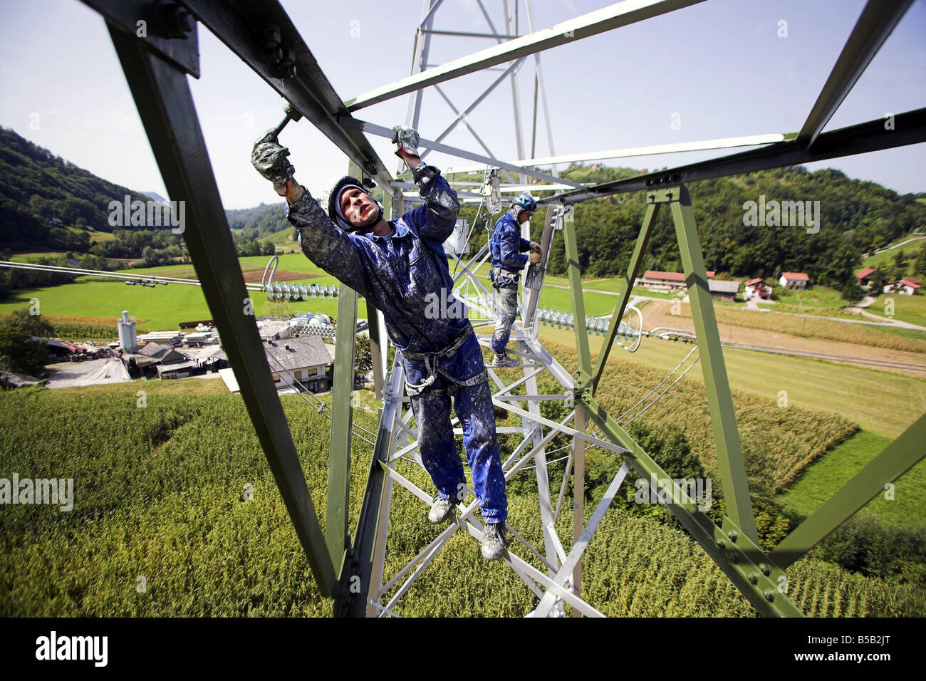 Workers maintaining the transmission line Stock Photo - Alamy