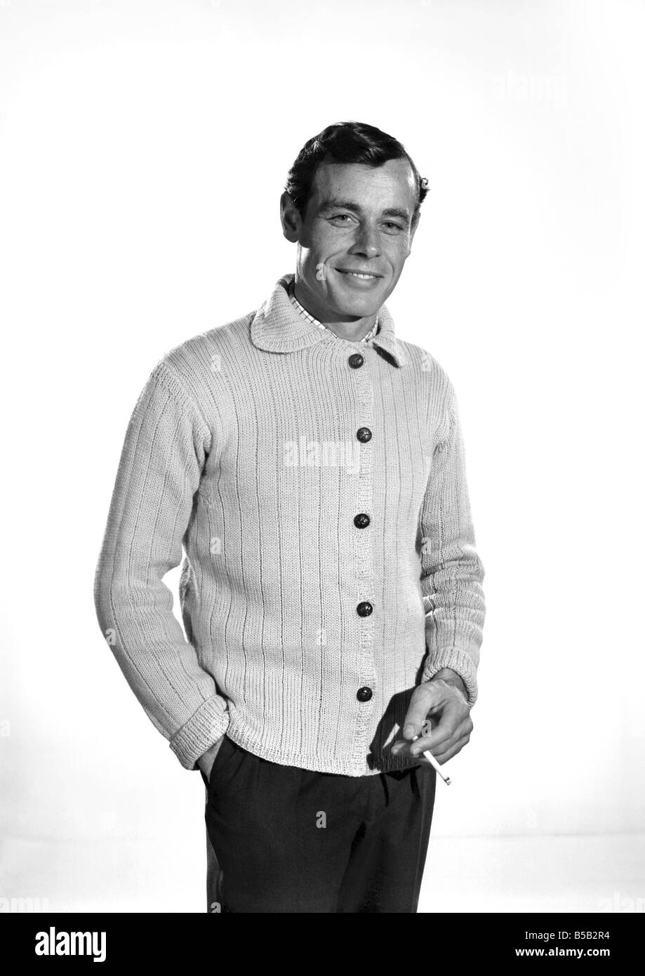 Model John Handy wearing cardigan in Reveille Studio . 1960 Stock Photo ...