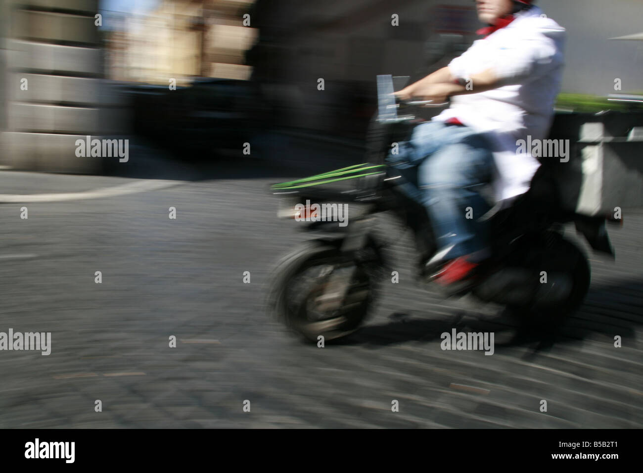 person riding scooter moped in rome italy Stock Photo - Alamy
