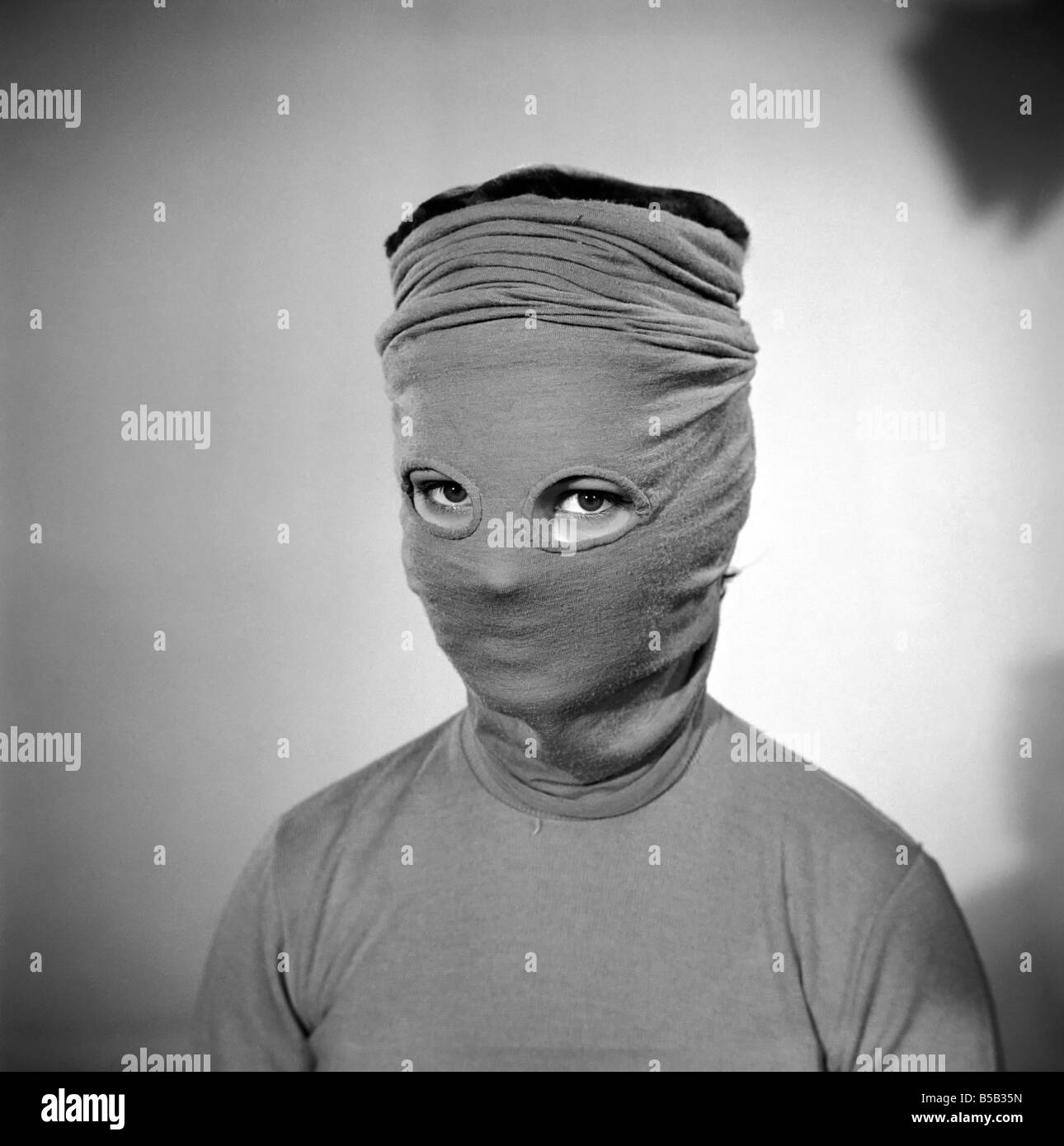 Wearing a mask 1950s hi-res stock photography and images - Alamy
