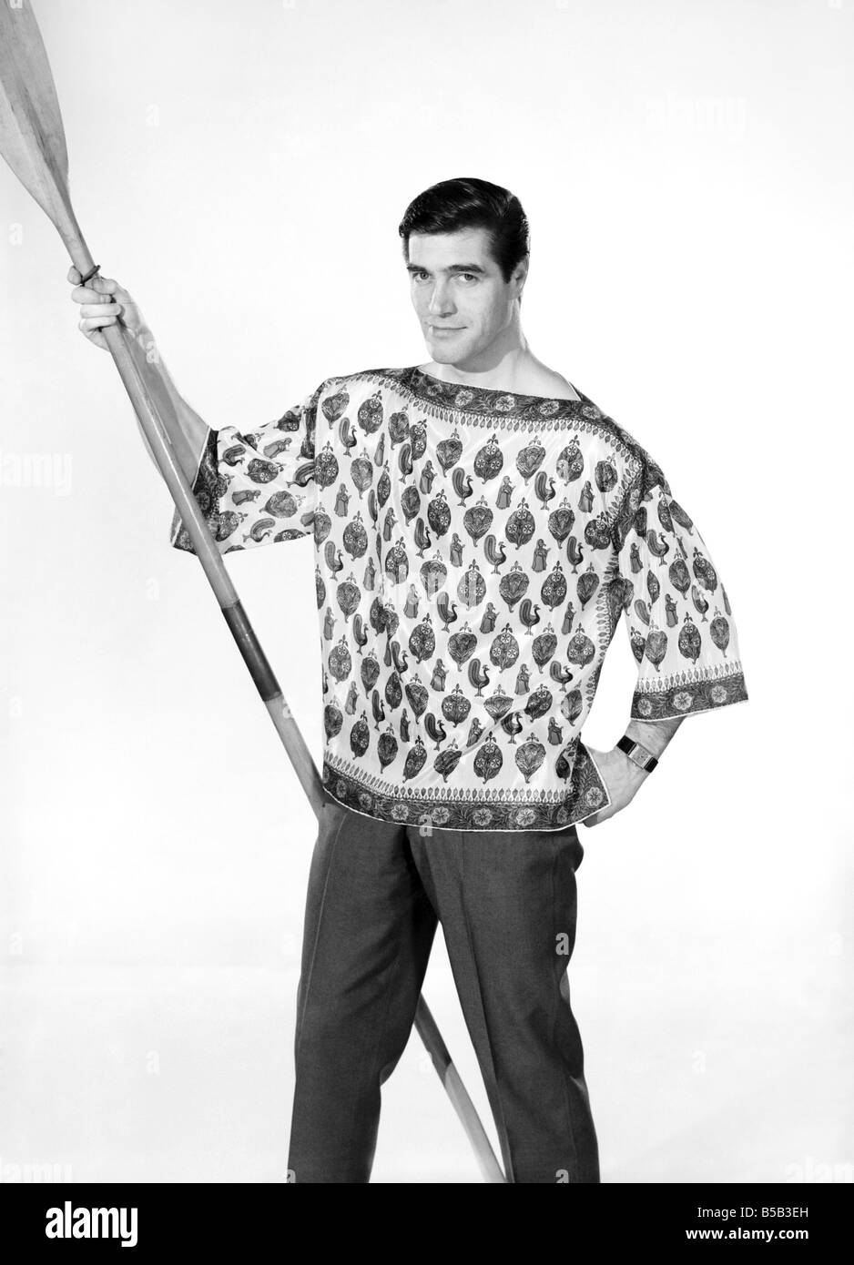 Male model Peter Christian wearing silk shirt seen here holding a oar ...