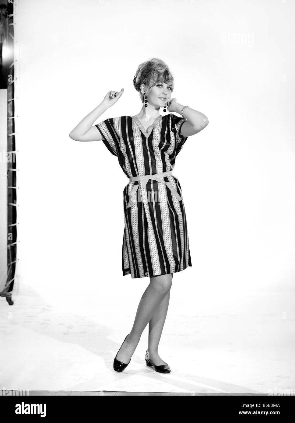 Woman wearing bold stripe summer dress. 1966 Stock Photo - Alamy