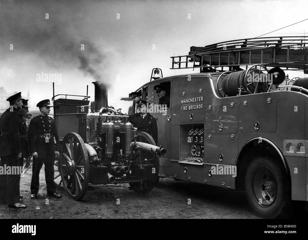 A 79 year old Shand-Mason steamer fire engine bellows steam and smoke ...