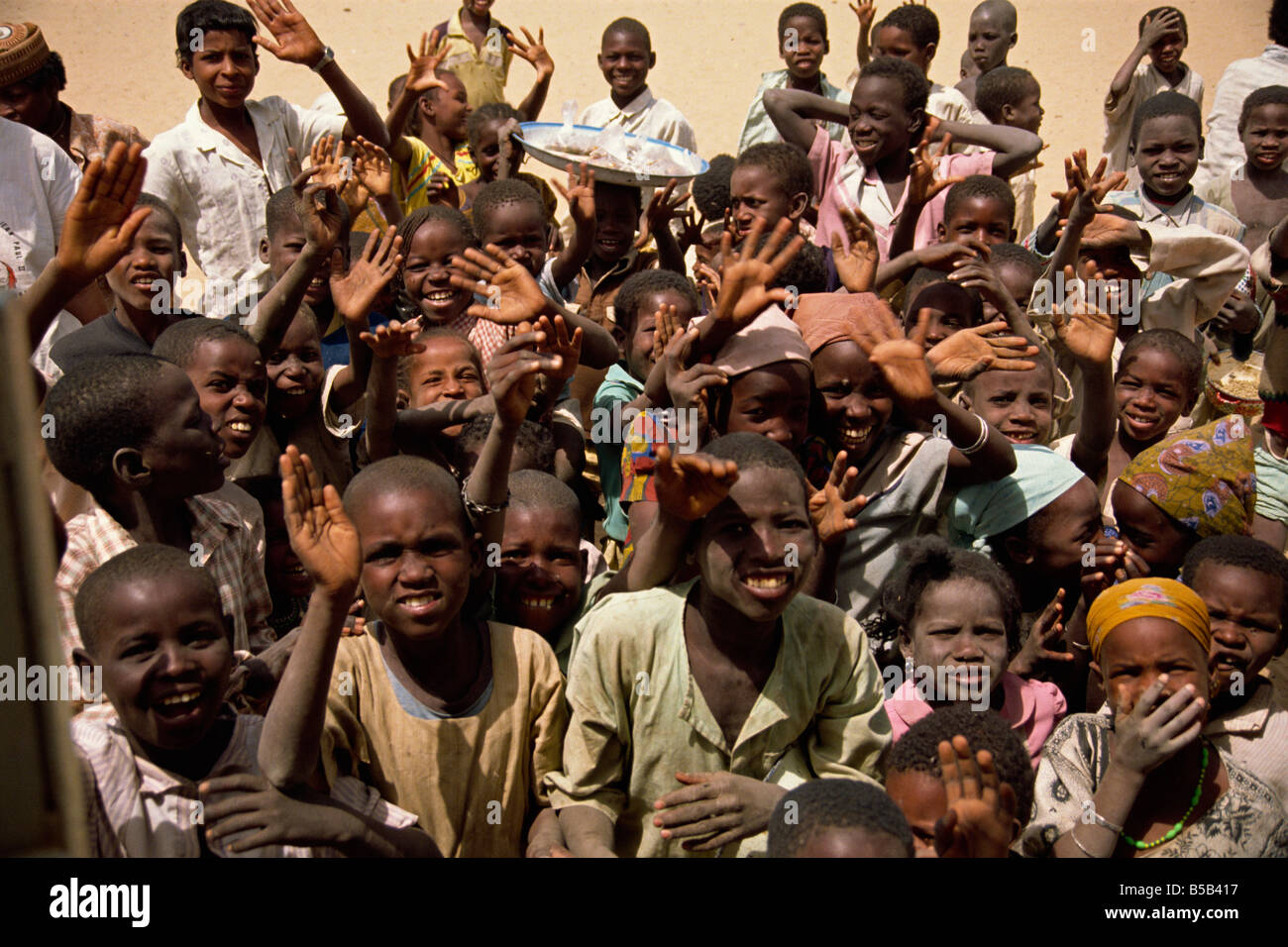 African children waving hi-res stock photography and images - Alamy