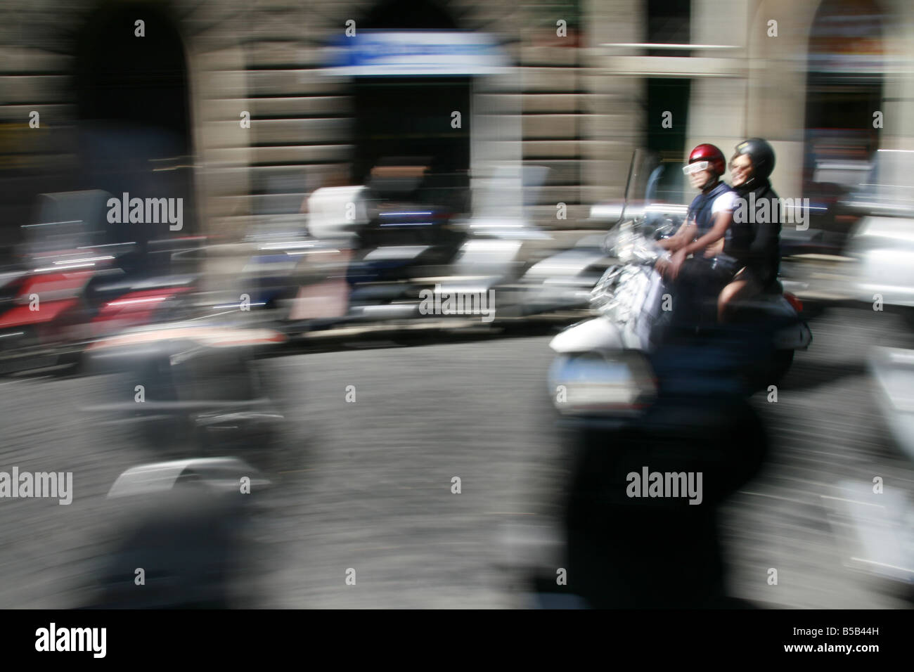person riding scooter moped in rome italy Stock Photo - Alamy