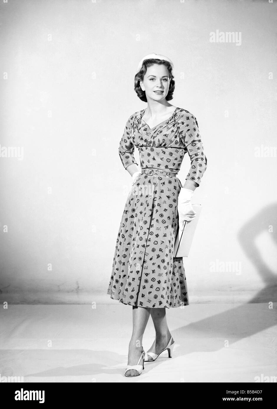 Clothing: Fashion: Dresses: Woman wearing summer dress. 1957 B304-002 ...