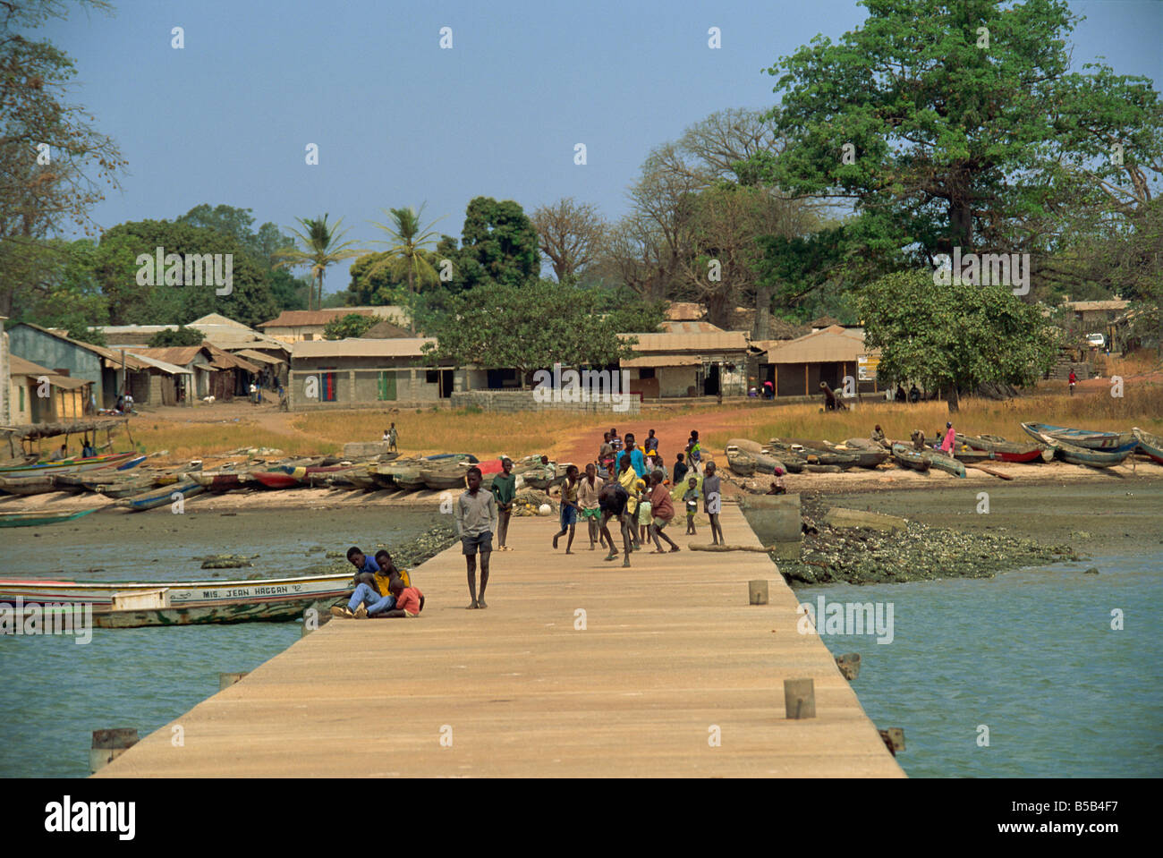 Locals on jetty, Albreda, The Gambia, West Africa, Africa Stock Photo ...
