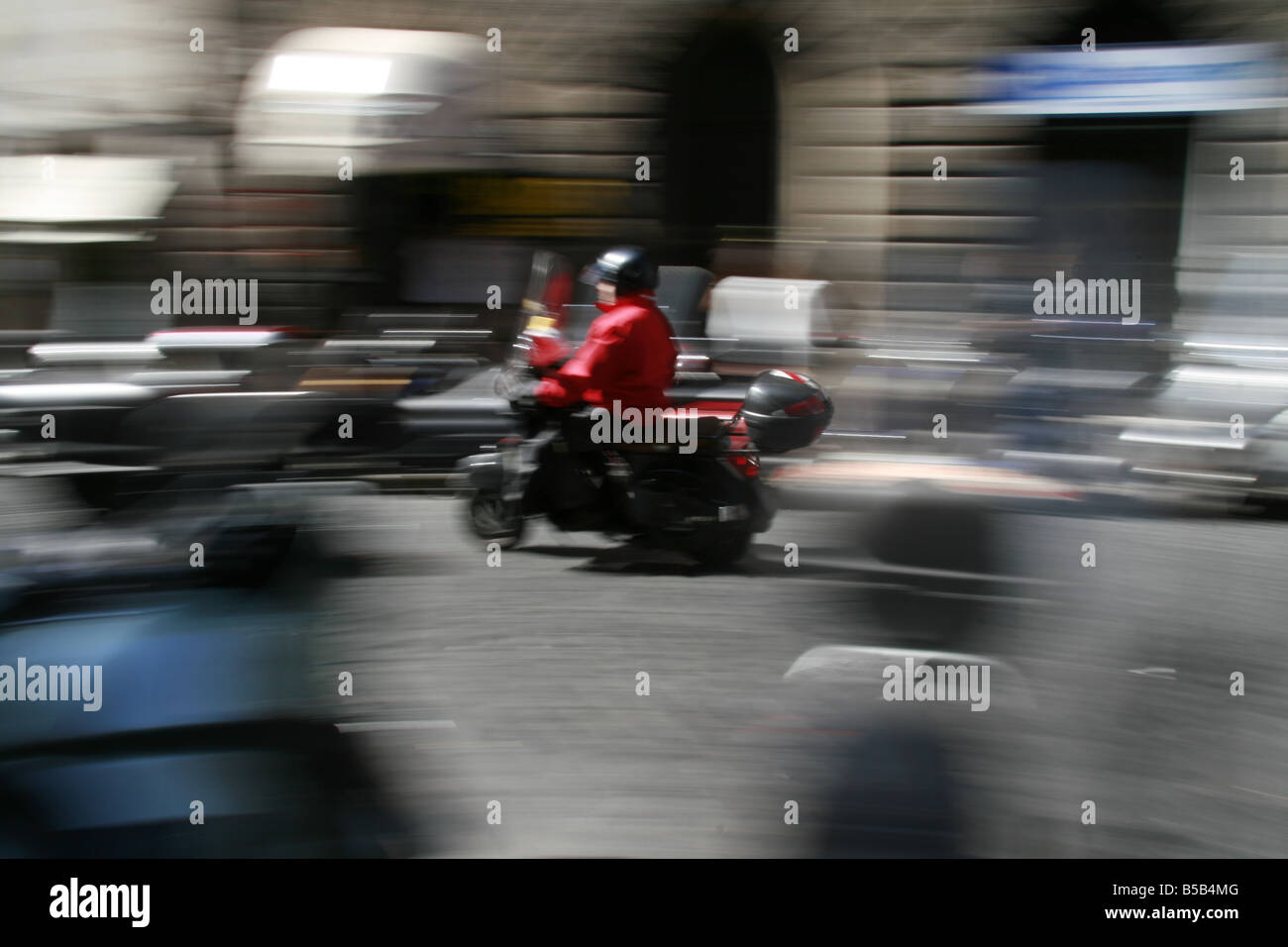 person riding scooter moped in rome italy Stock Photo - Alamy