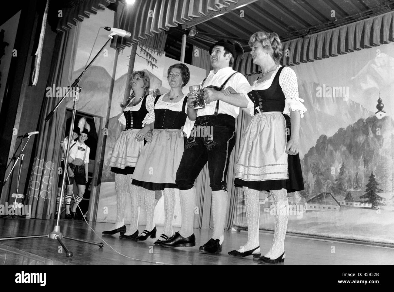 Members of a Bavarian band performing on stage wearing traditional ...