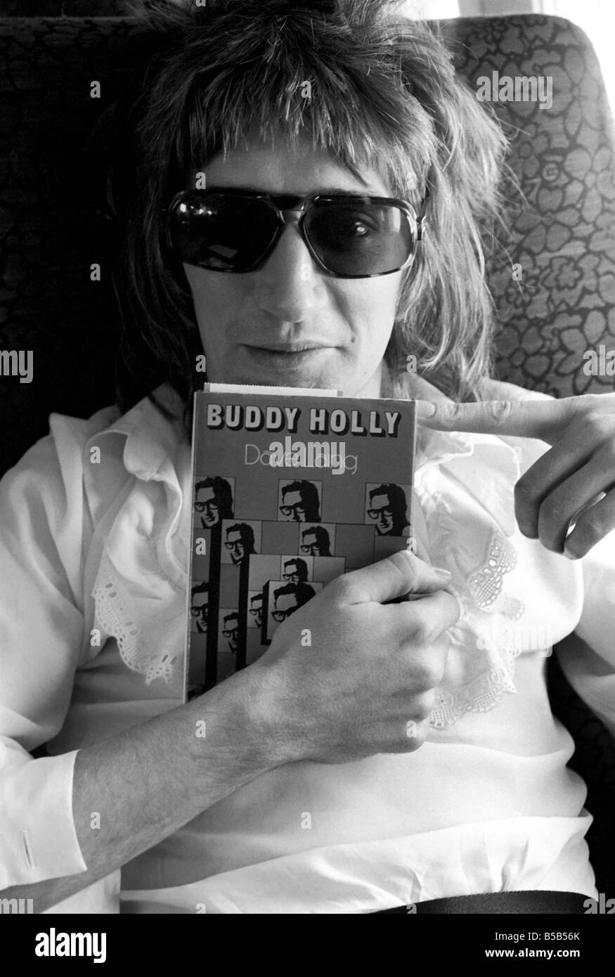 Rod Stewart and the Faces on tour in America. ;Rod sitting on the plane ...