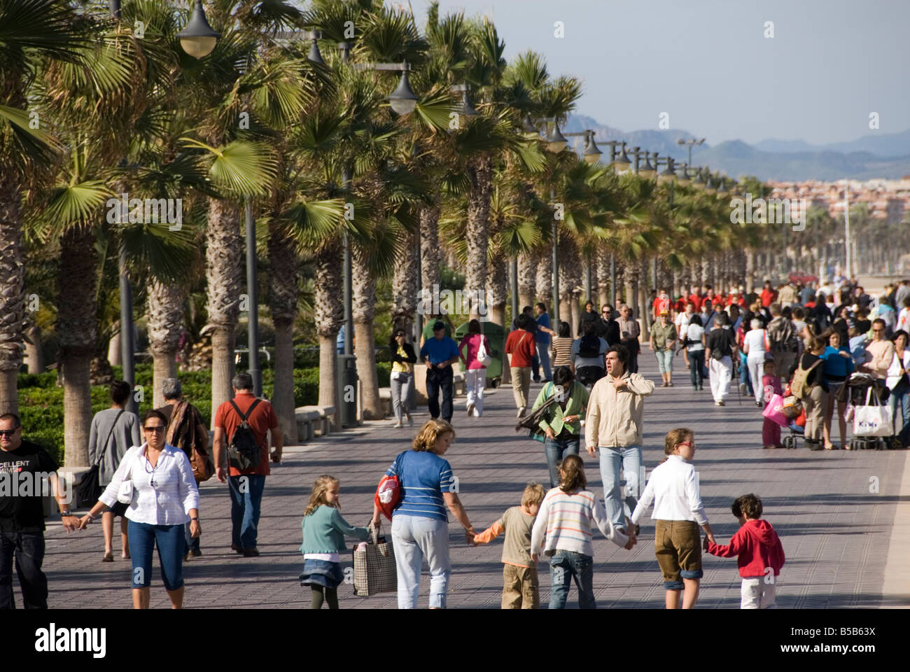 Crowded beach front promenade at Playa Malvarrosa in the city of ...